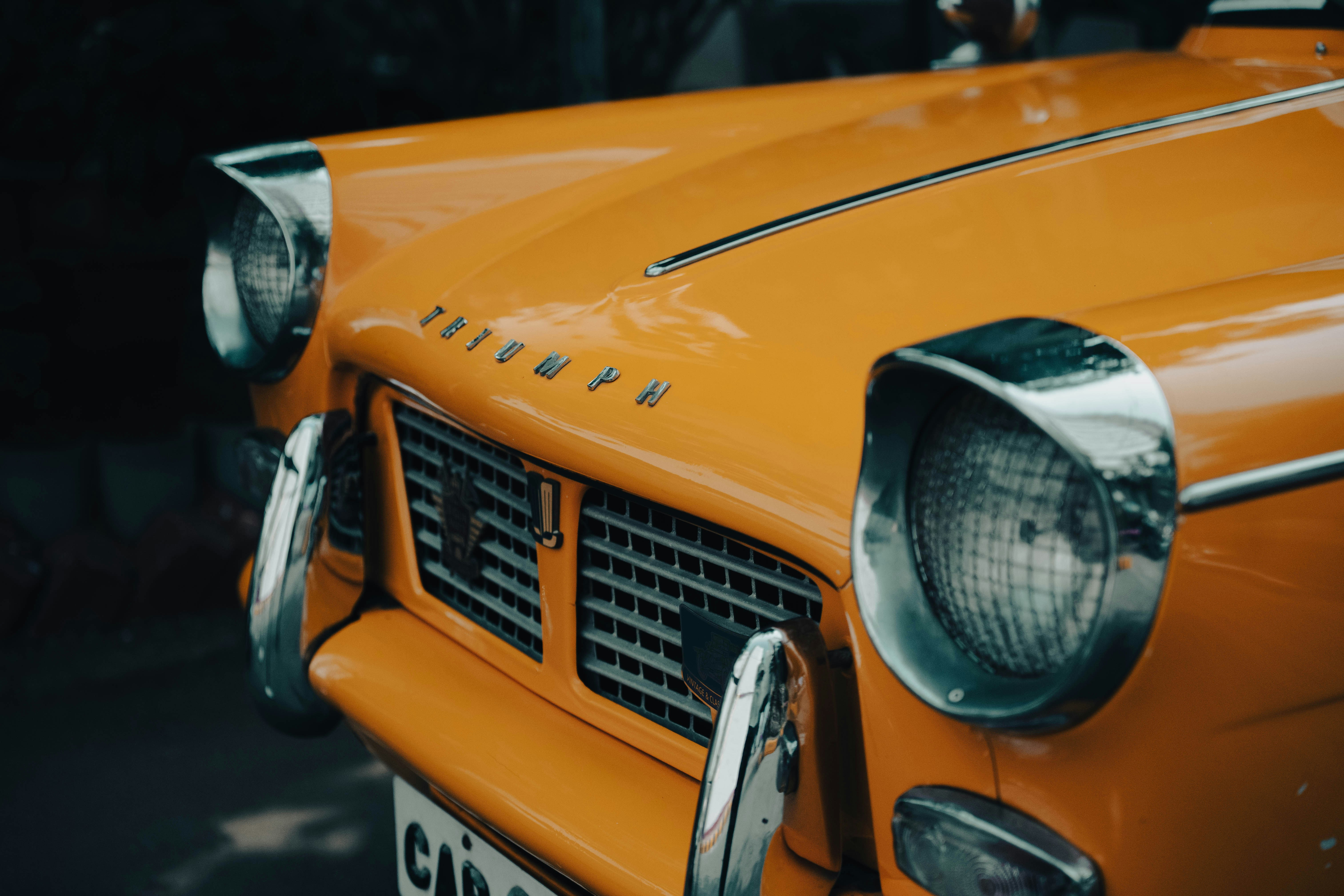 Orange Vintage Triumph Grille: A Close-Up of Character and Chrome