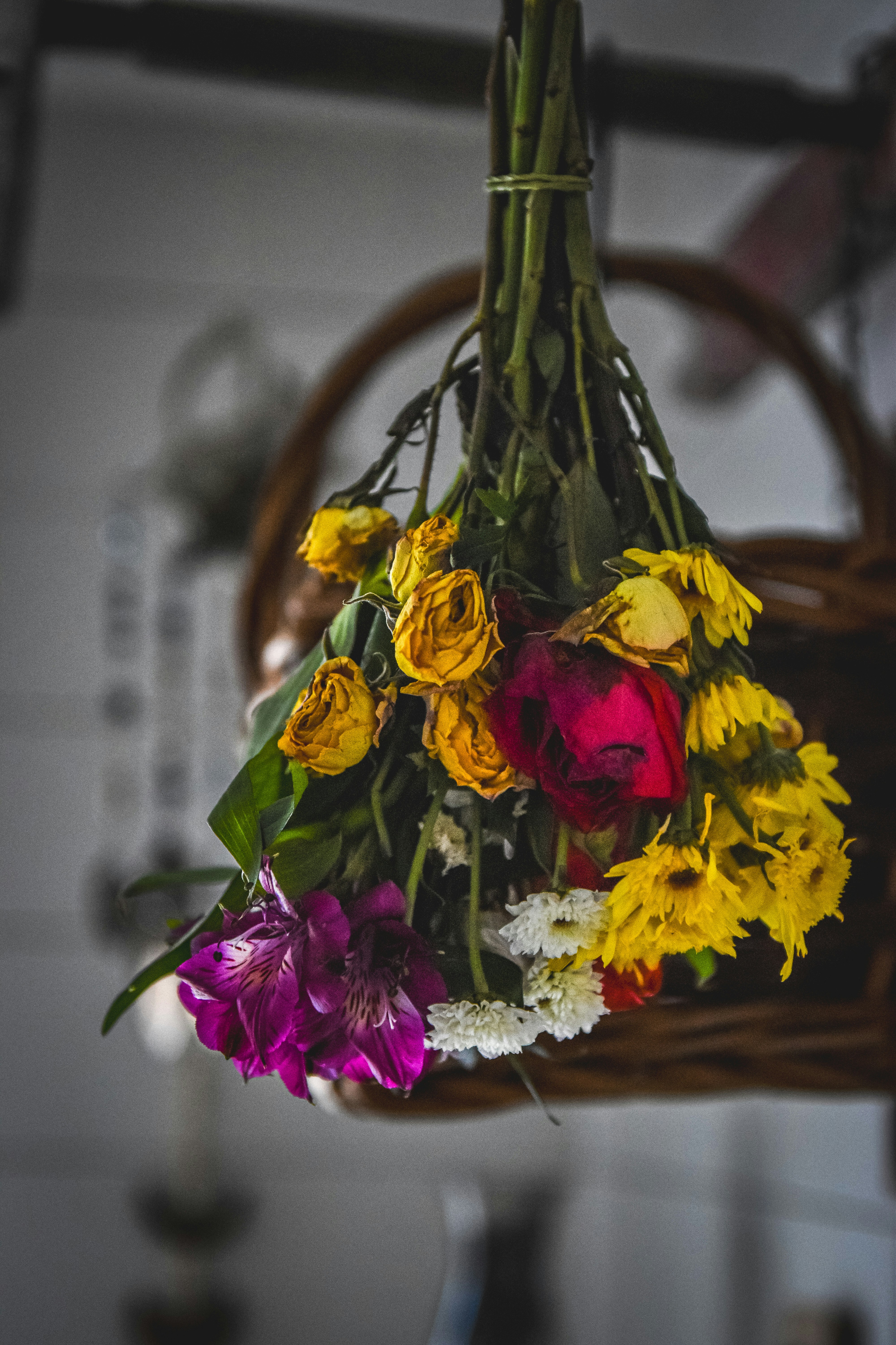 Hanging Bouquet: a cascade of yellows and purples in a rustic basket