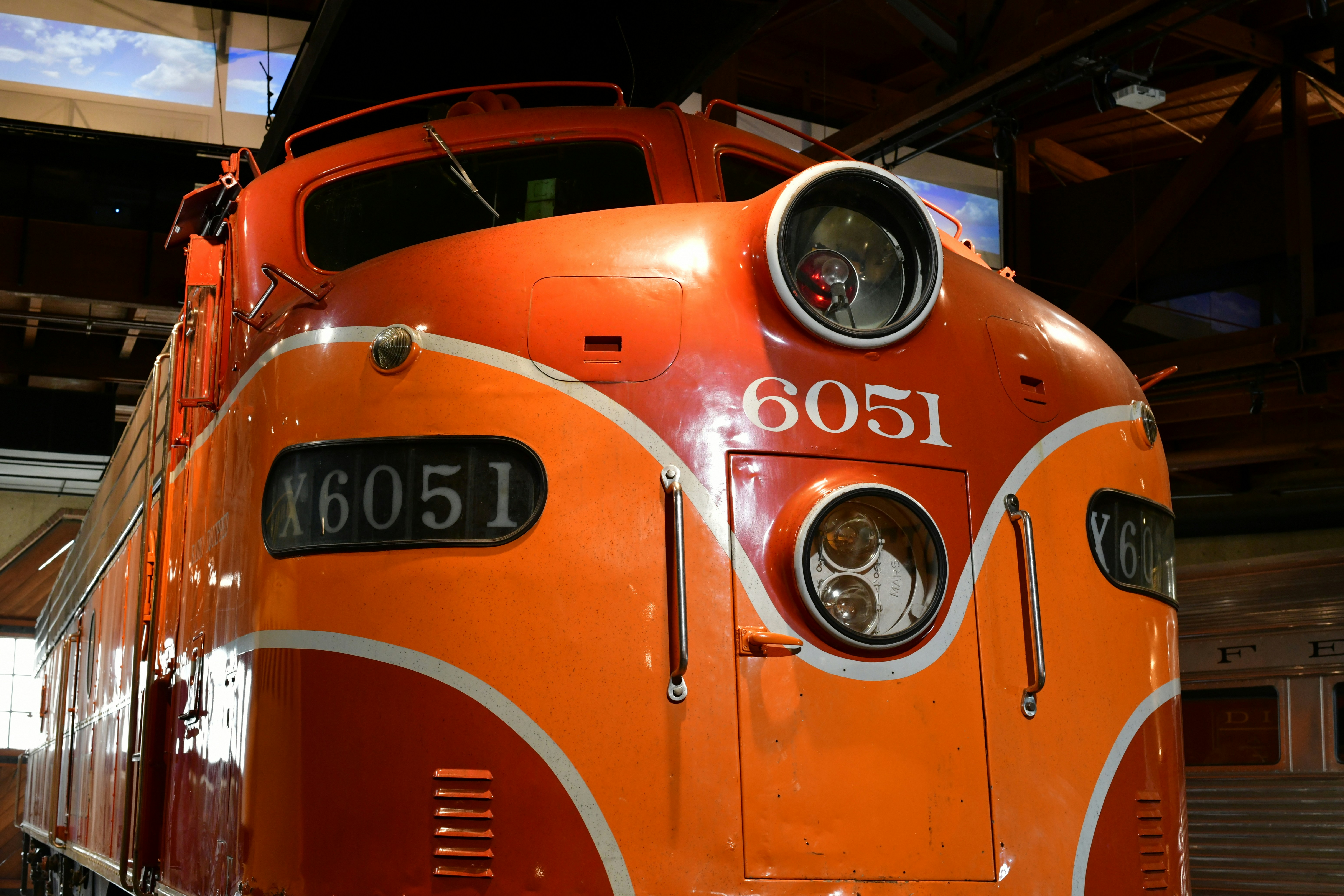 Orange Lightning: Close-up of a Vintage Locomotive’s Front Elevation
