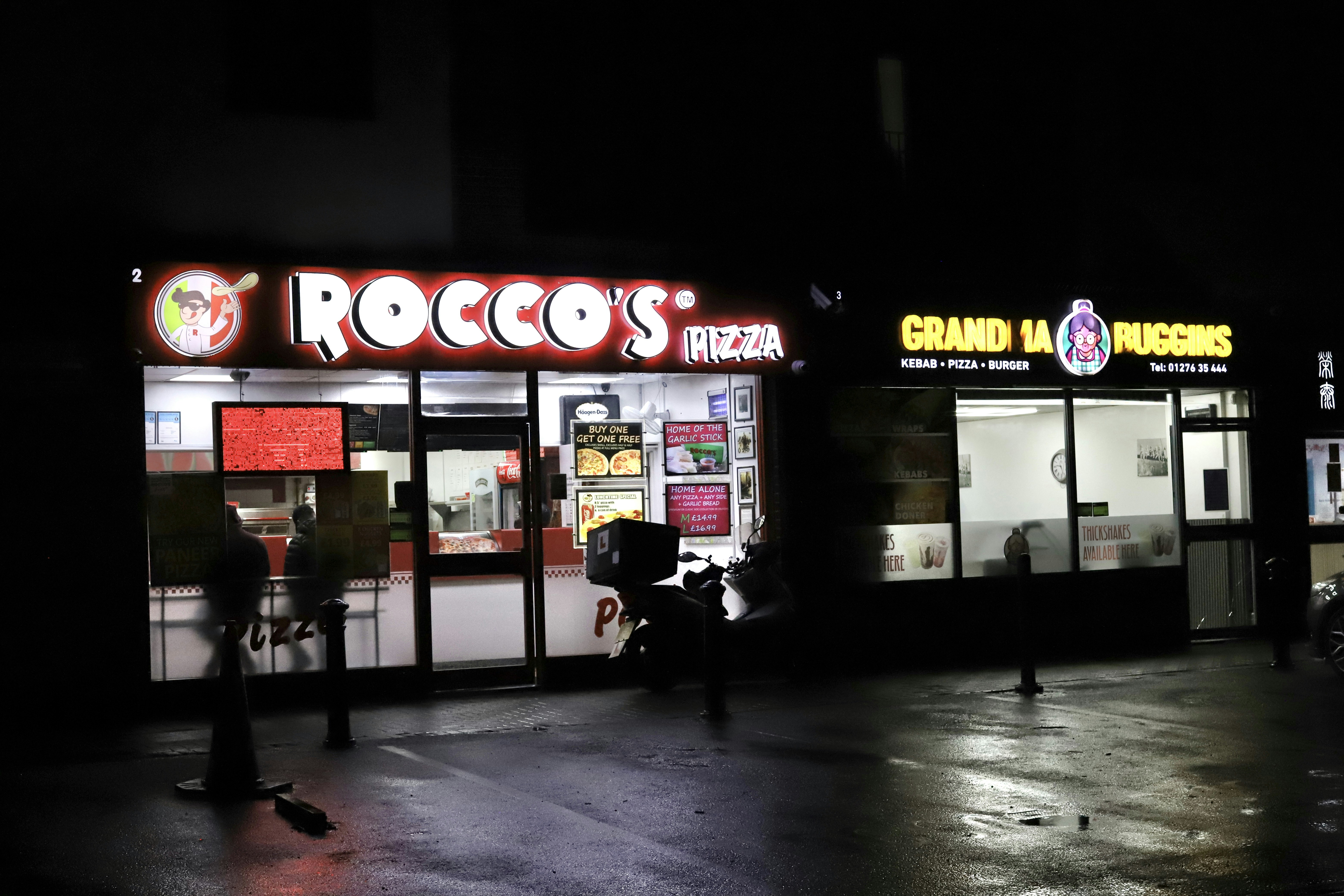 Neon Signage After Dark: Rocco’s Pizza and Grand-A-Munchos