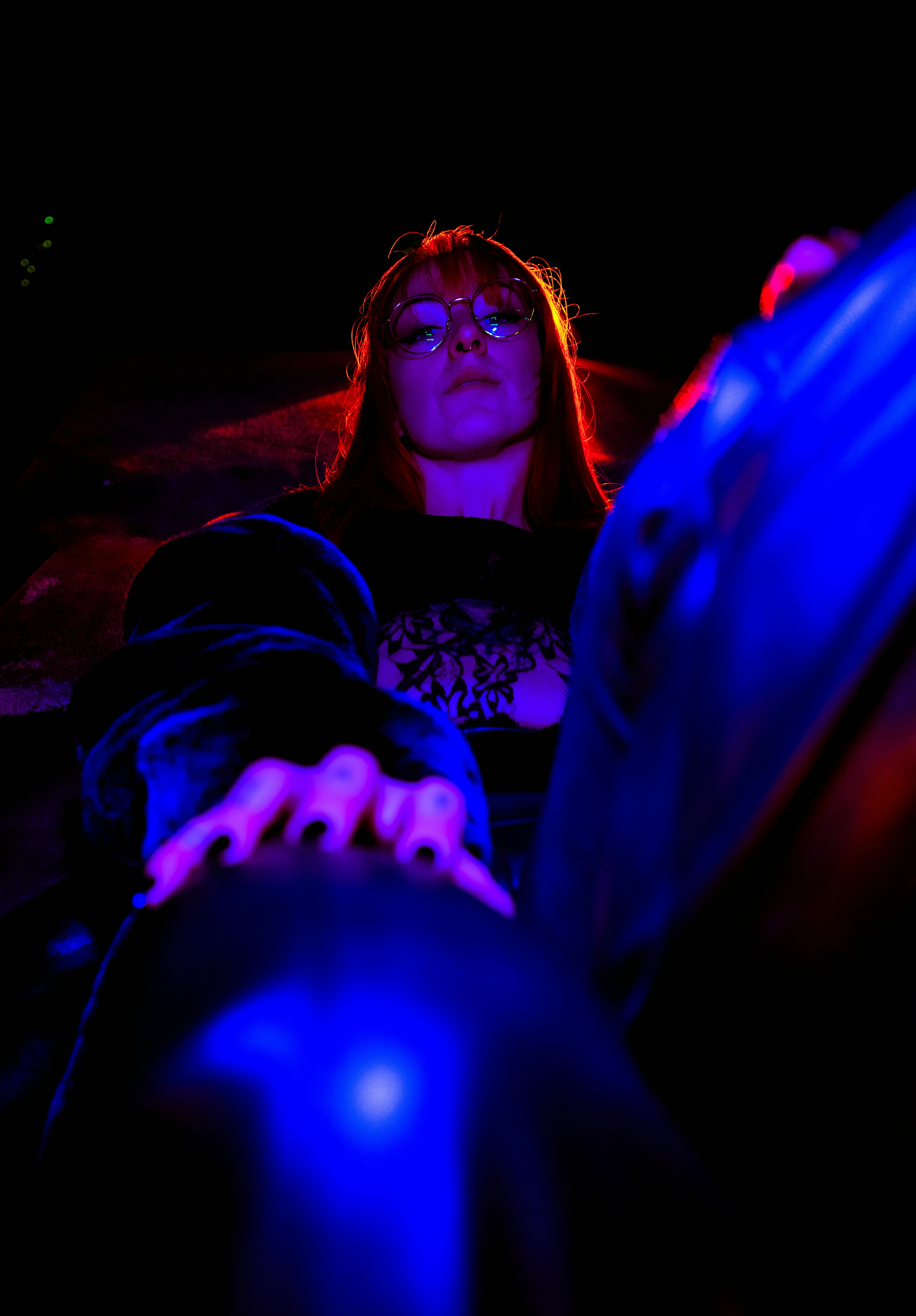 Upward Gaze Under Neon Veil