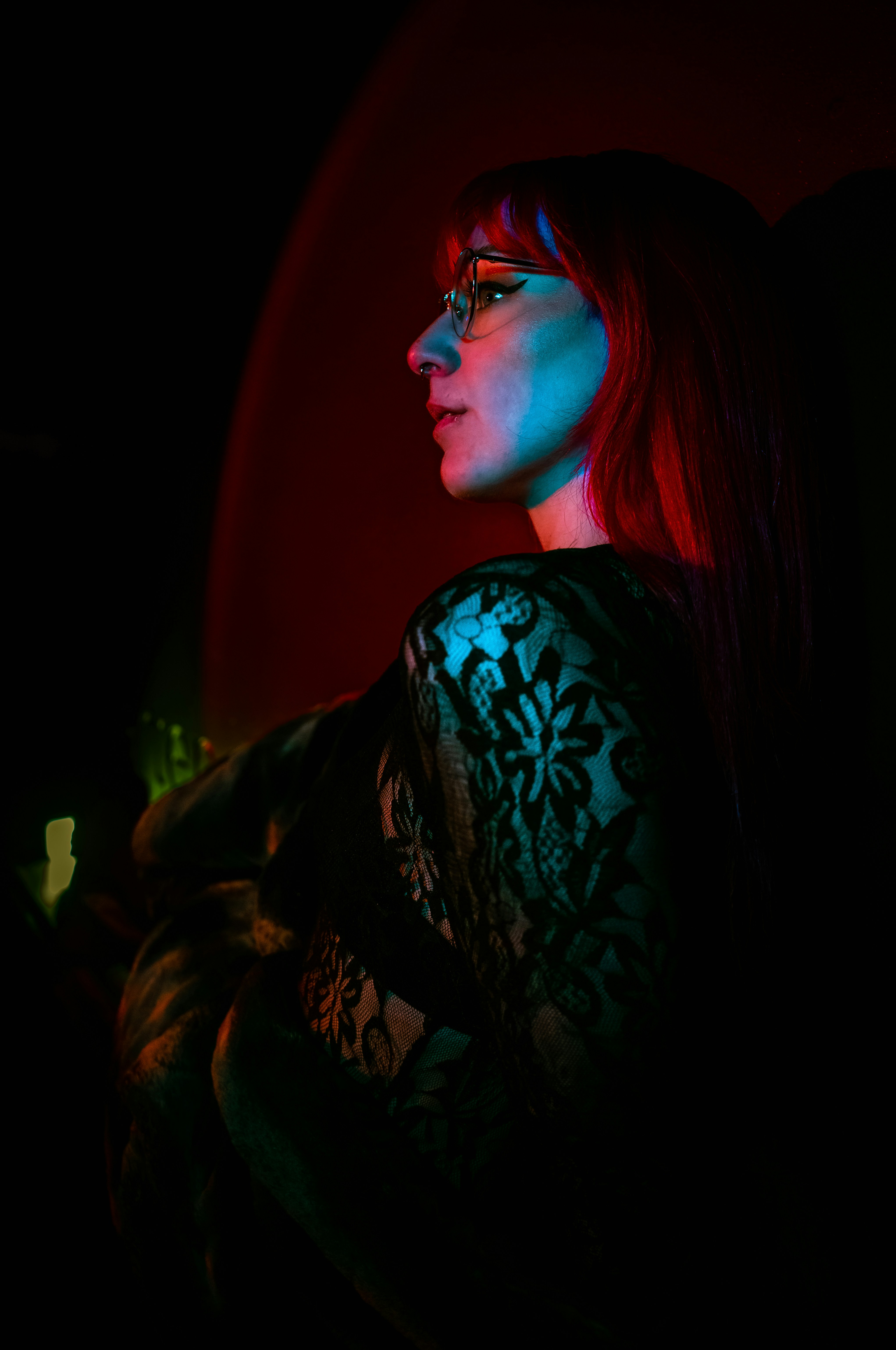 Neon Silhouette: Red and Cyan Light on a Lace-Clad Profile