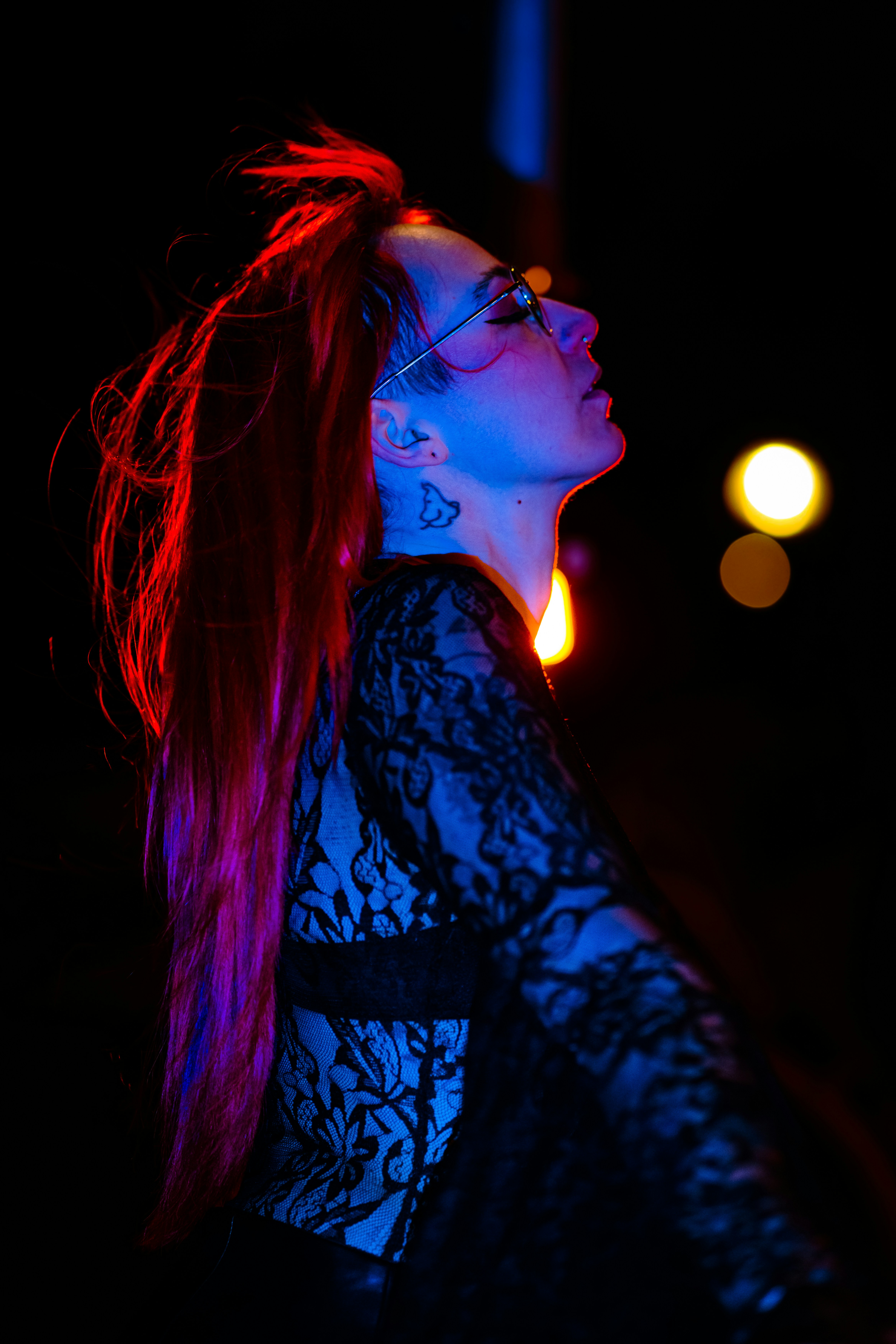 Neon Gaze: Violet Hair Against a Velvet Night