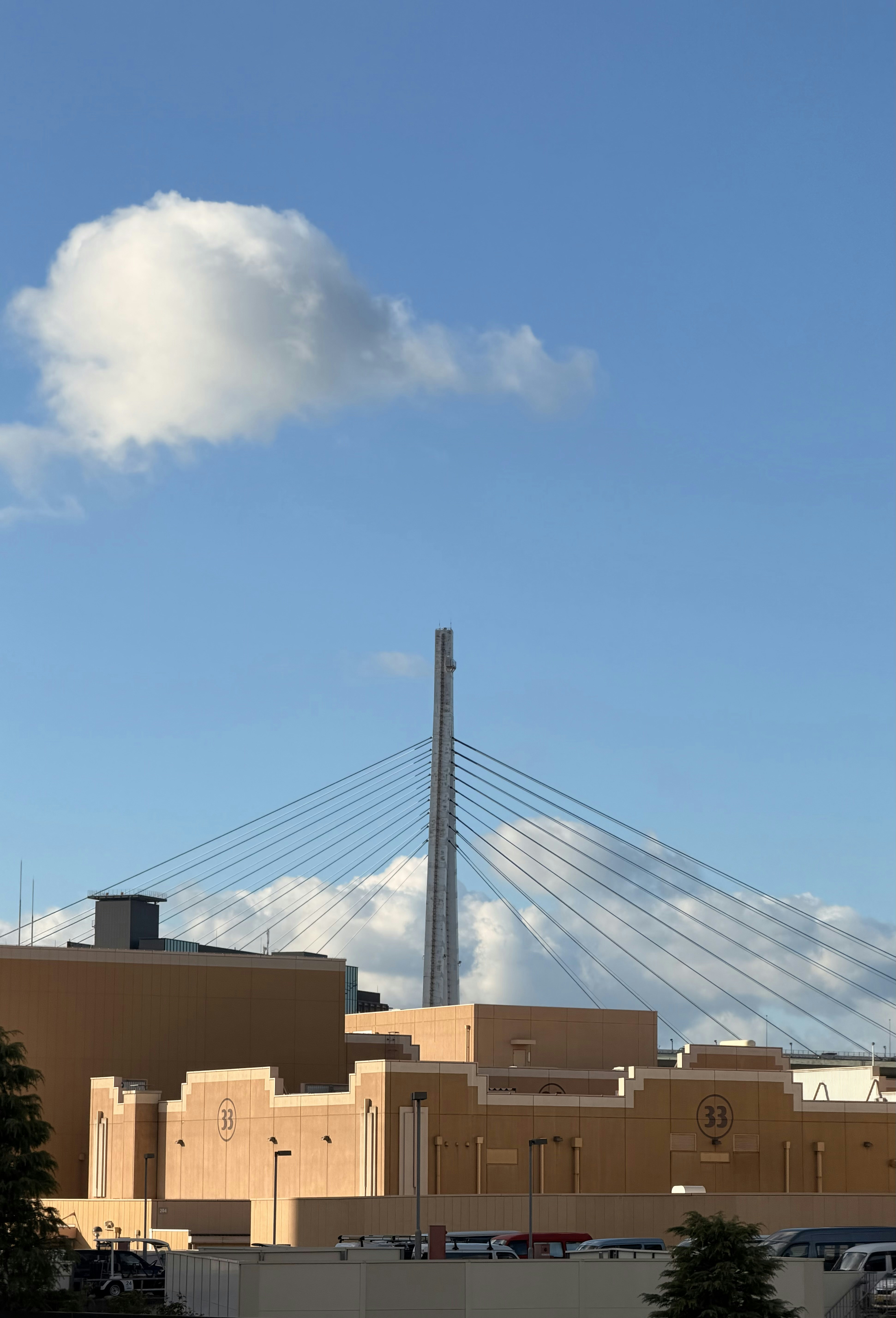 Bridge Tower Rising Above City Blocks at Dusk