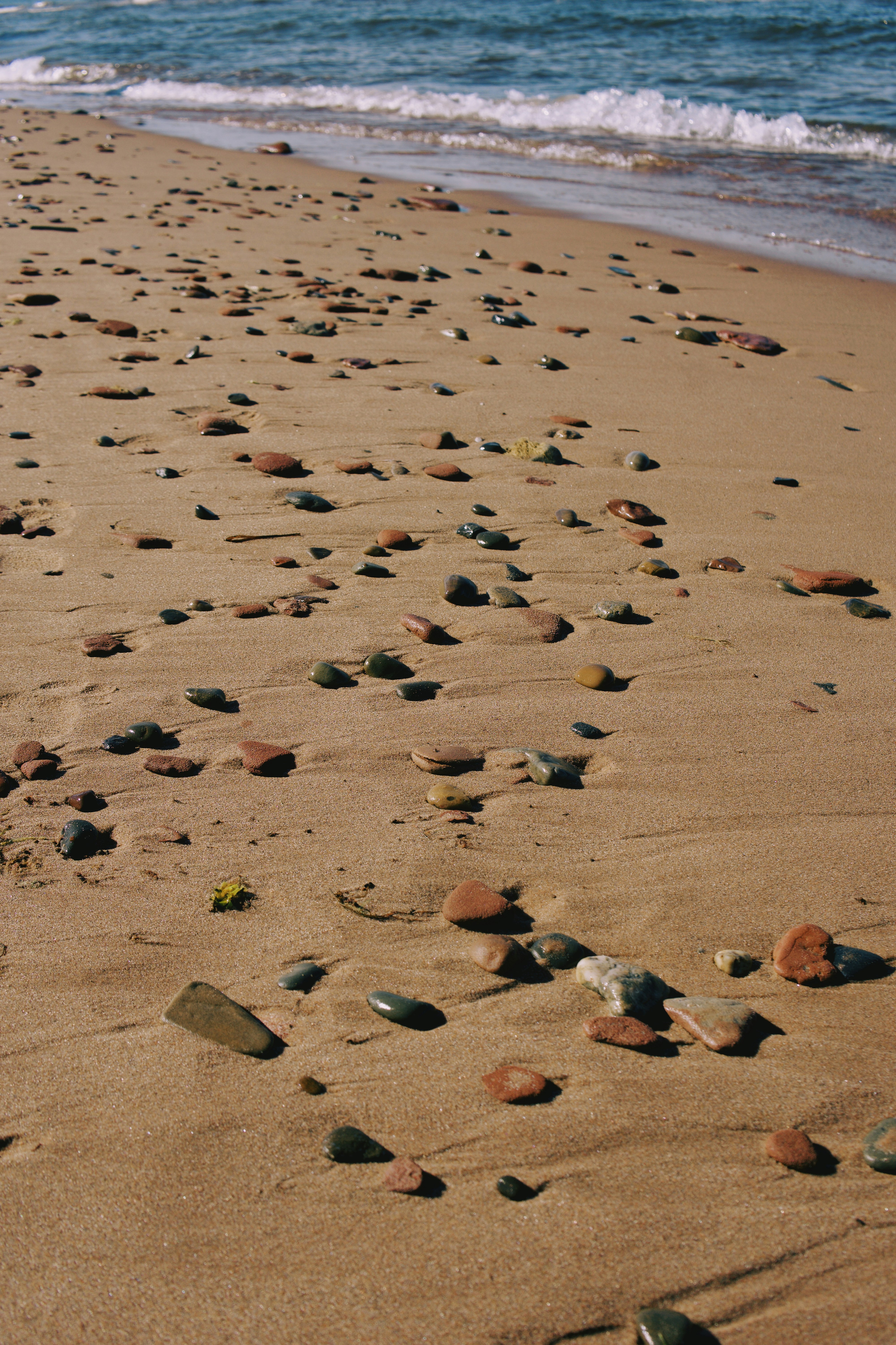 Pebble-strewn shoreline: a ribbon of sea and stones