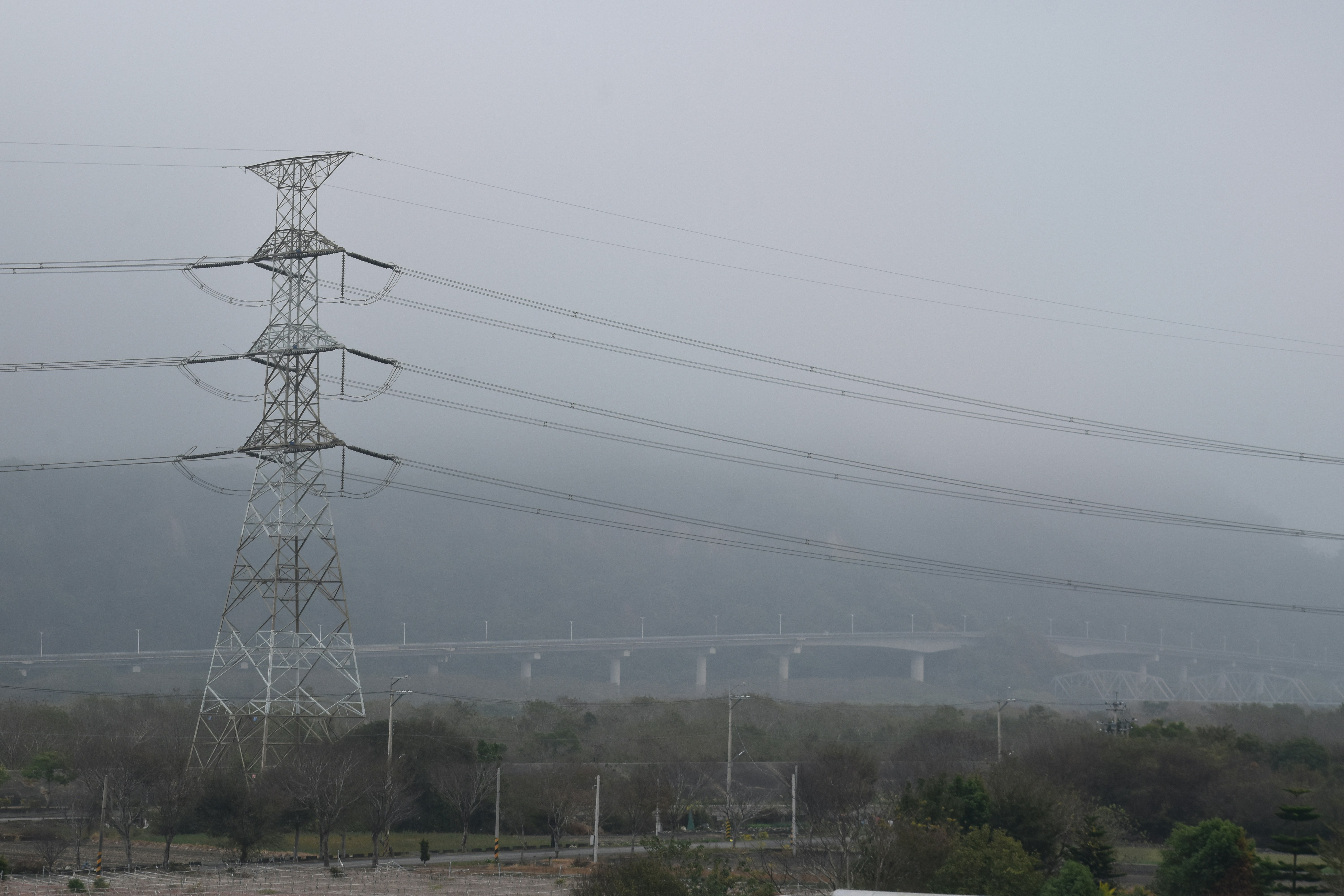 Silent Giants: Transmission Towers across a Quiet Valley