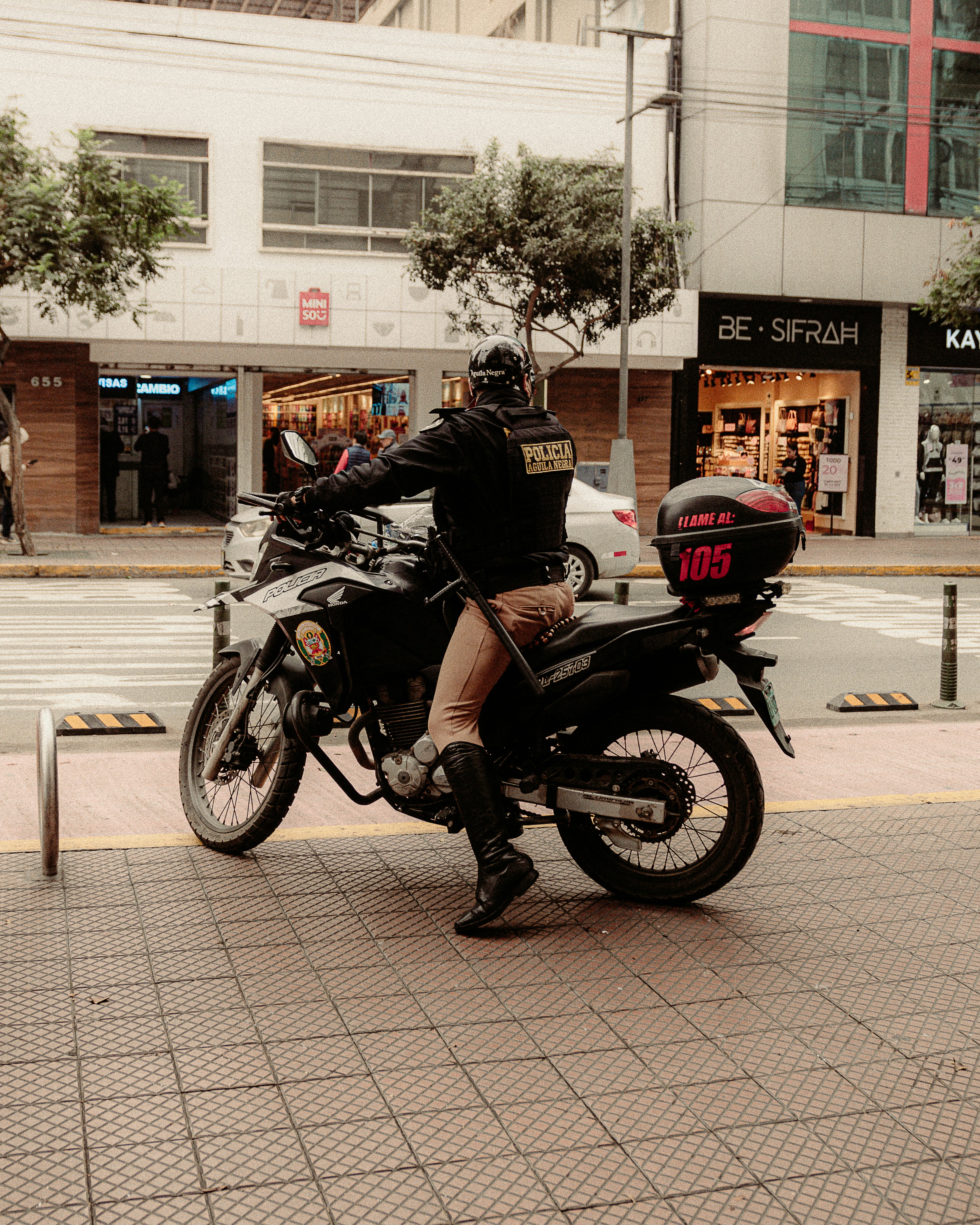 Street Observer: Police Rider on a City Motorbike