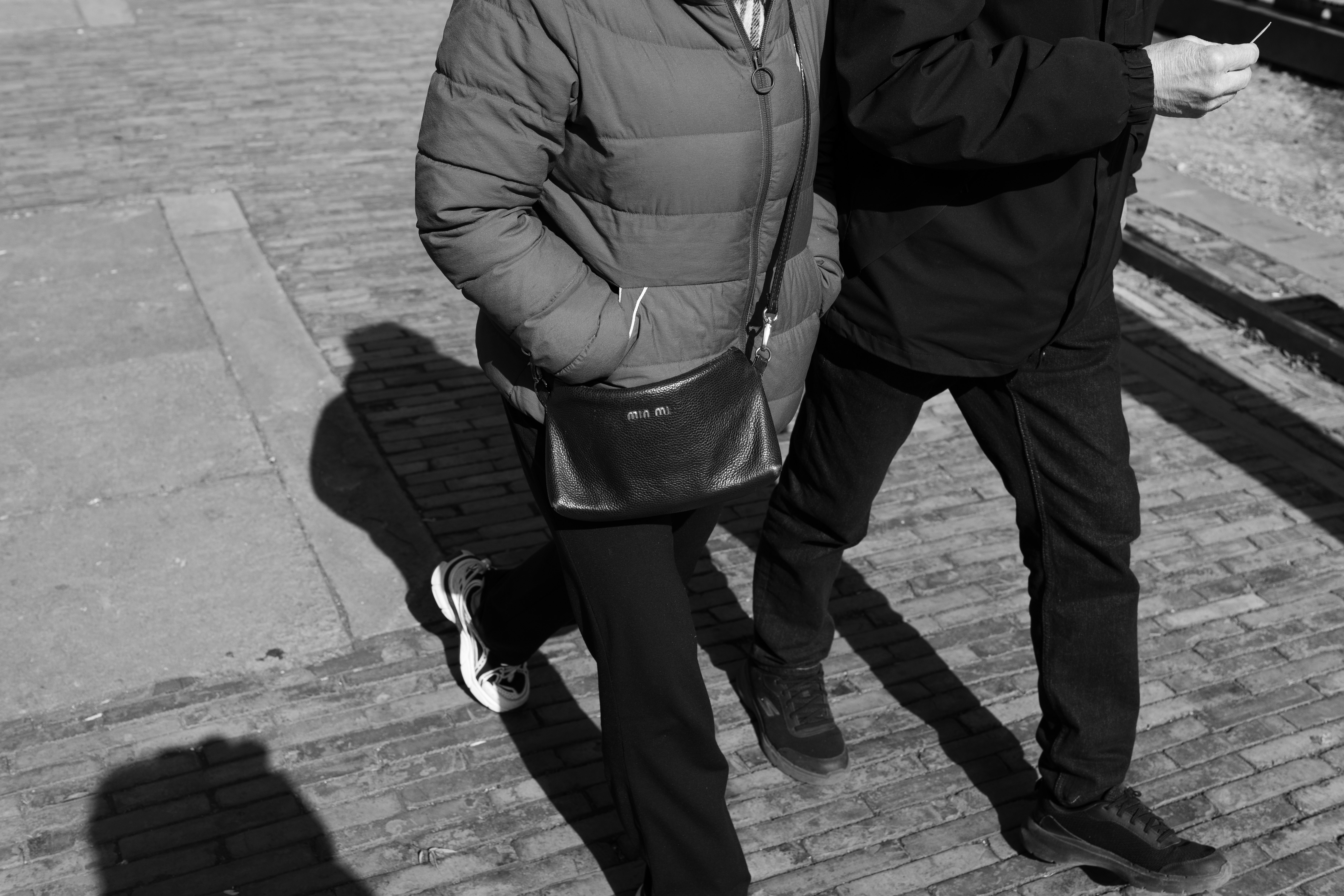 Stride in Sync: A City Moment in Black and White