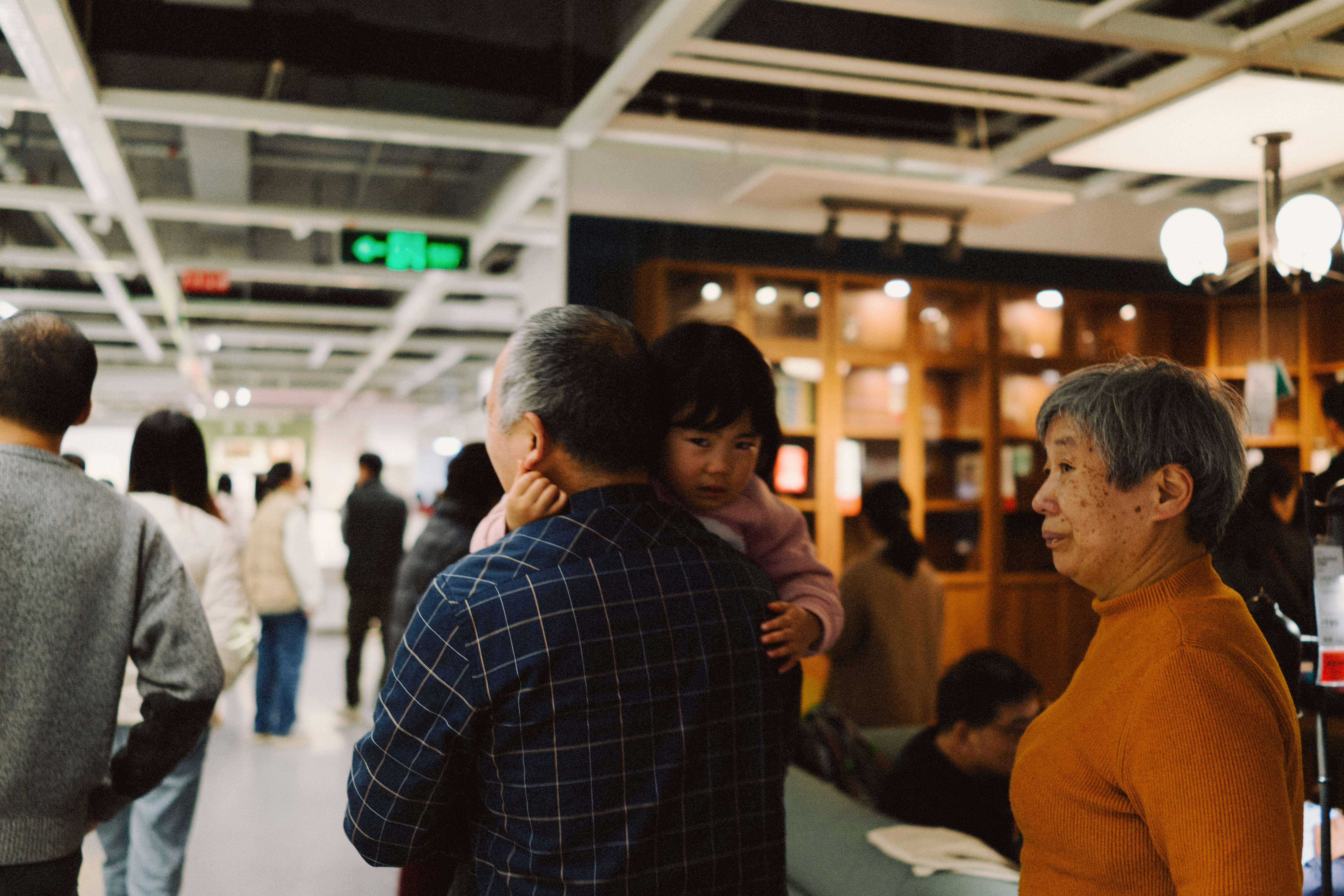 Family shopping together in a large store.