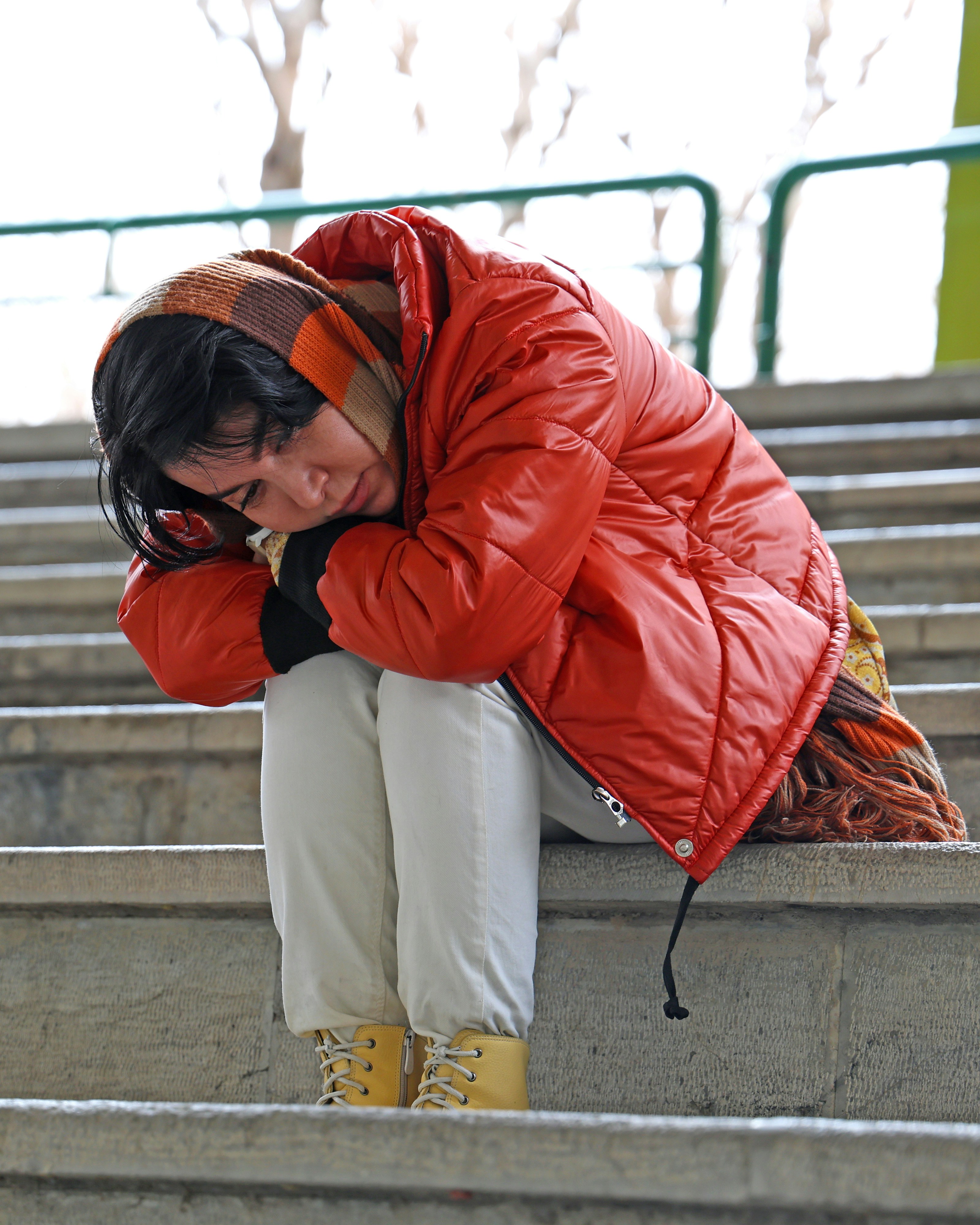 Red Winter Pause: A Quiet Moment on the Steps