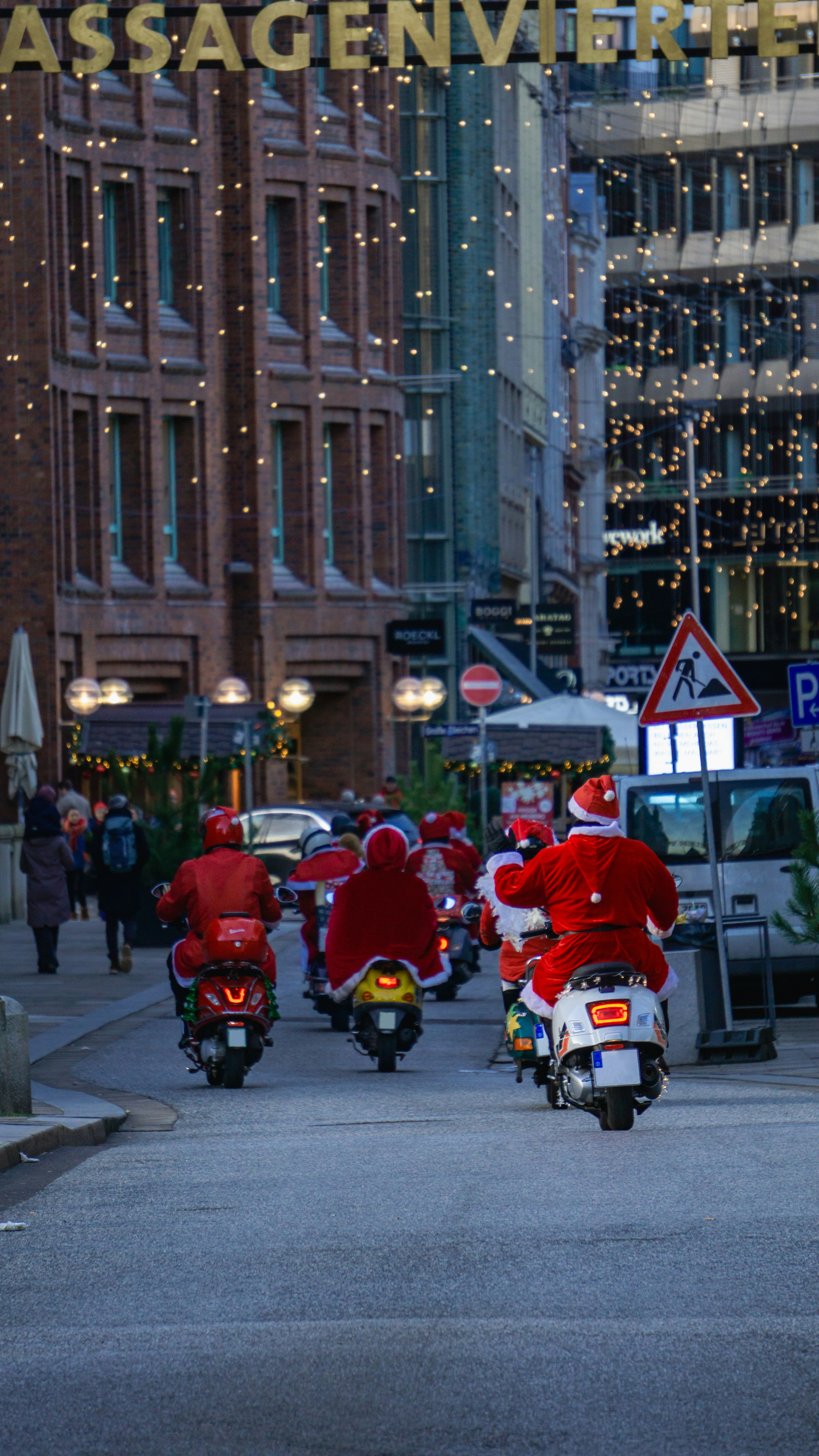 Santa Ones on the Move: Festive Ride Through a City Night