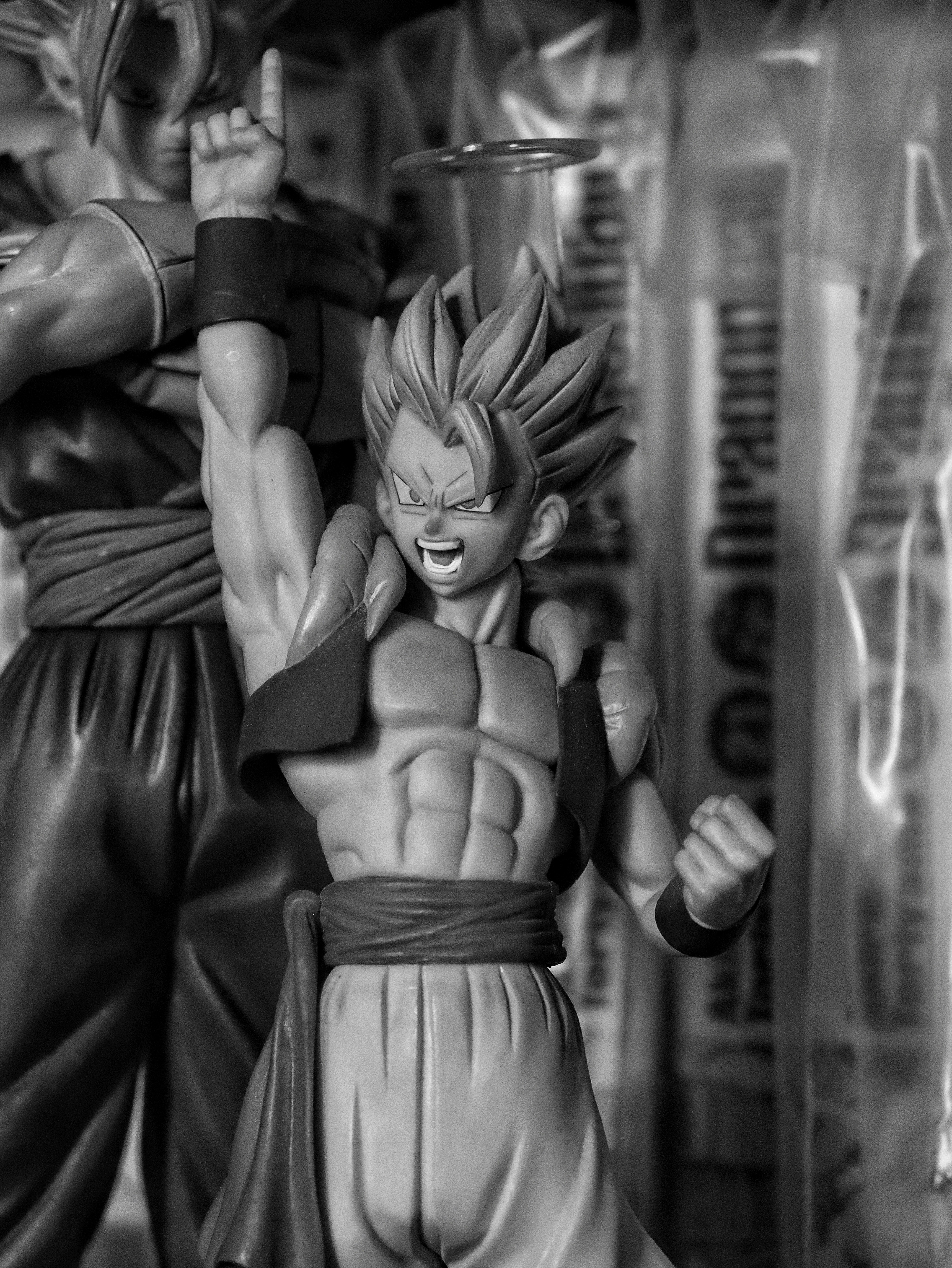 Dragon Ball Z Figures in a Display Case: A Dynamic Victory Pose