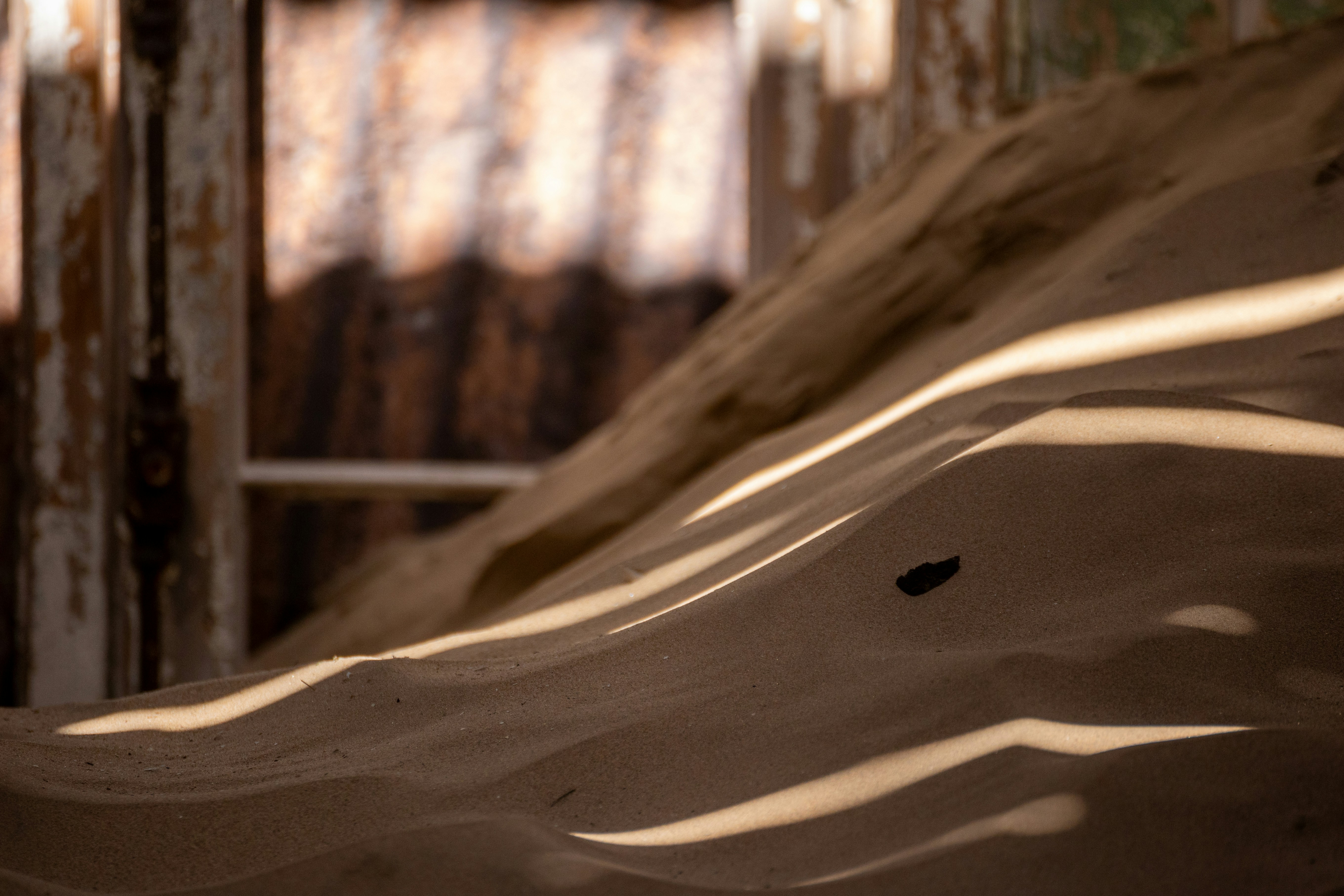 Desert Light: Ripples of Sand in a Quiet Corridor