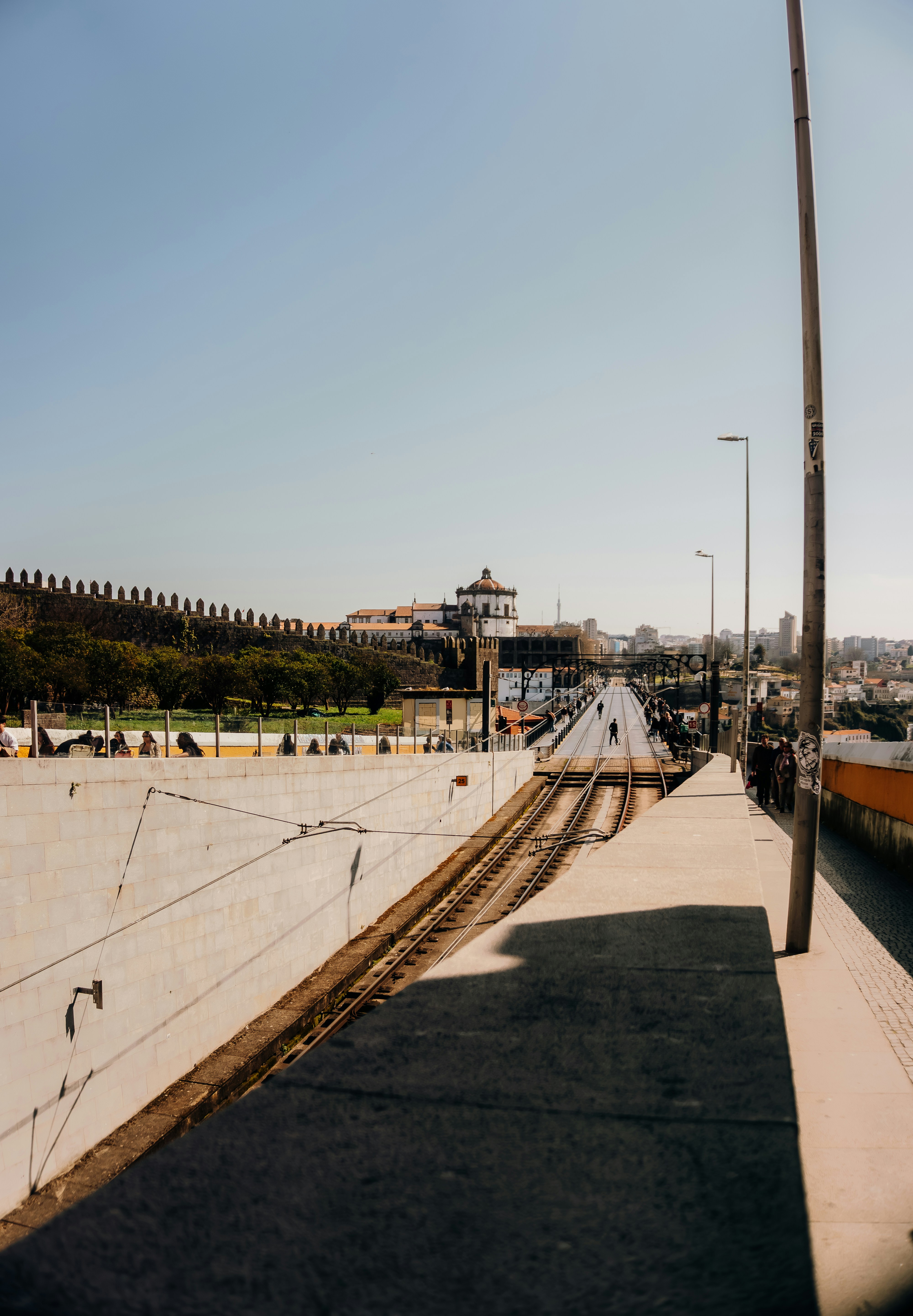 Along the Quiet Span: A Rooftop View of Tracks to the City