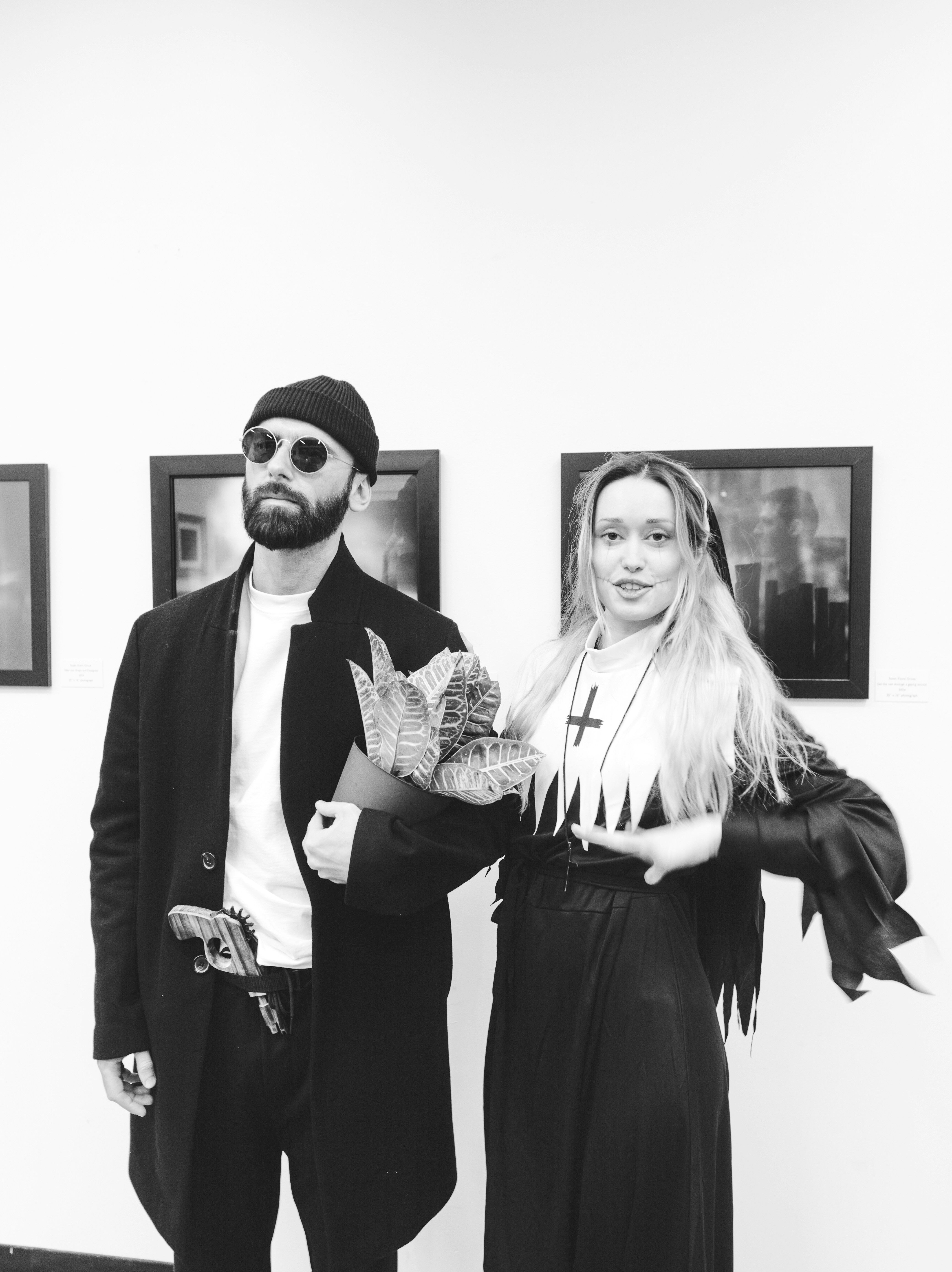 Gallery Duo in Black-and-White: Man in Beret and Woman in Dramatic Pose