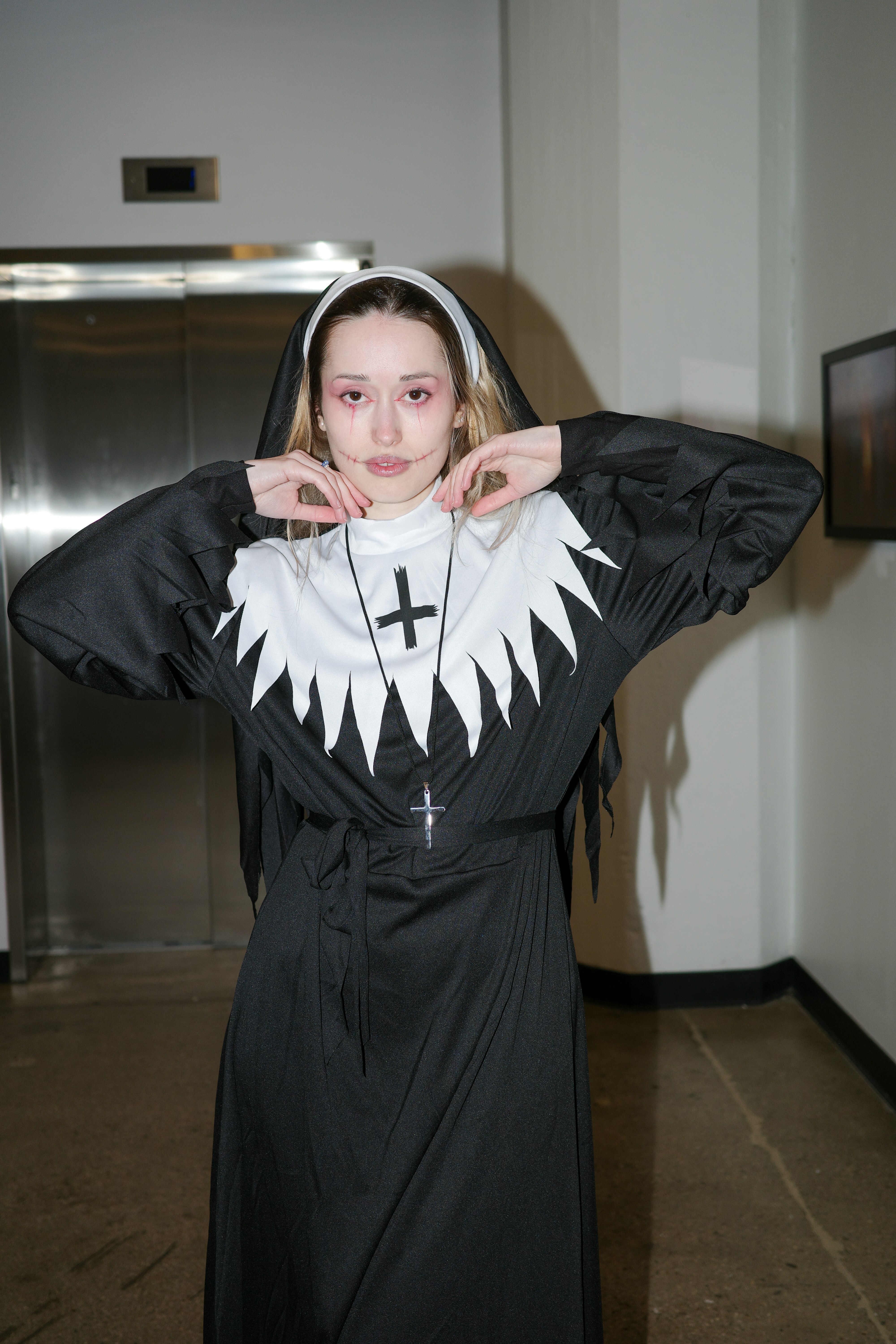 Nun in Night-Black Attire with White Ragged Collar, Mid-Pose Pose