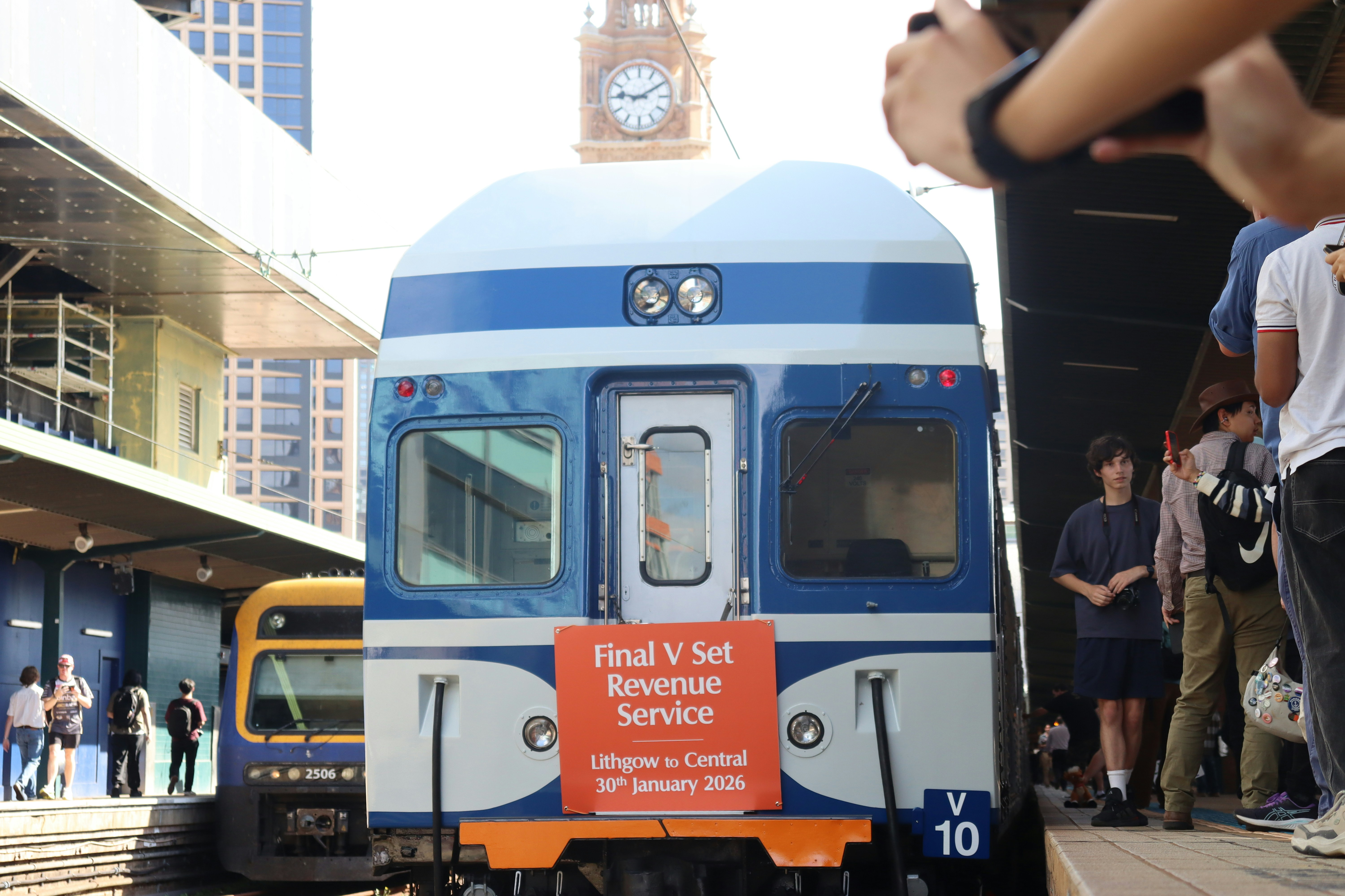 Blue Locomotive at Platform: Final V Set Revenue Service Banner