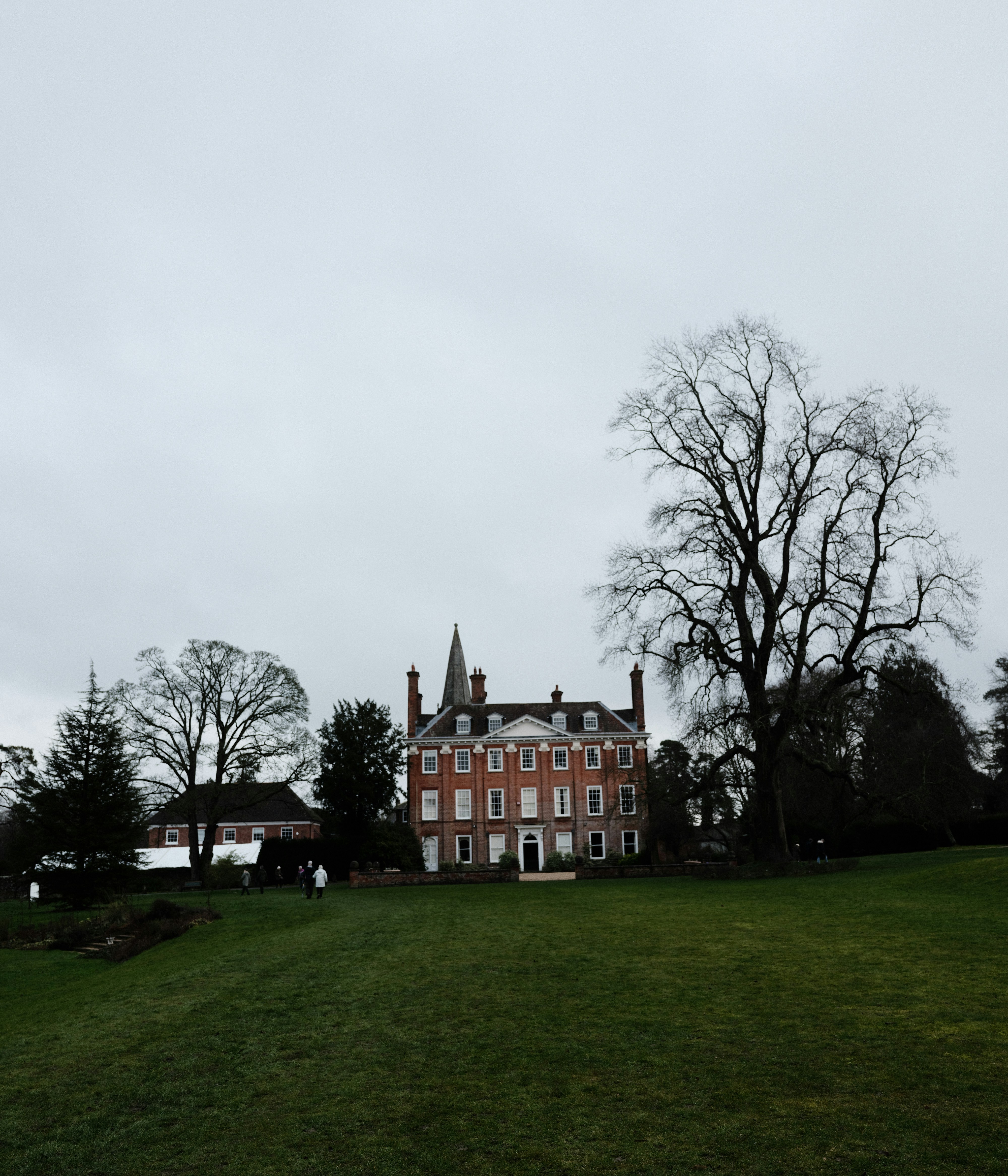 The Georgian Manor Reaches for the Overcast Sky