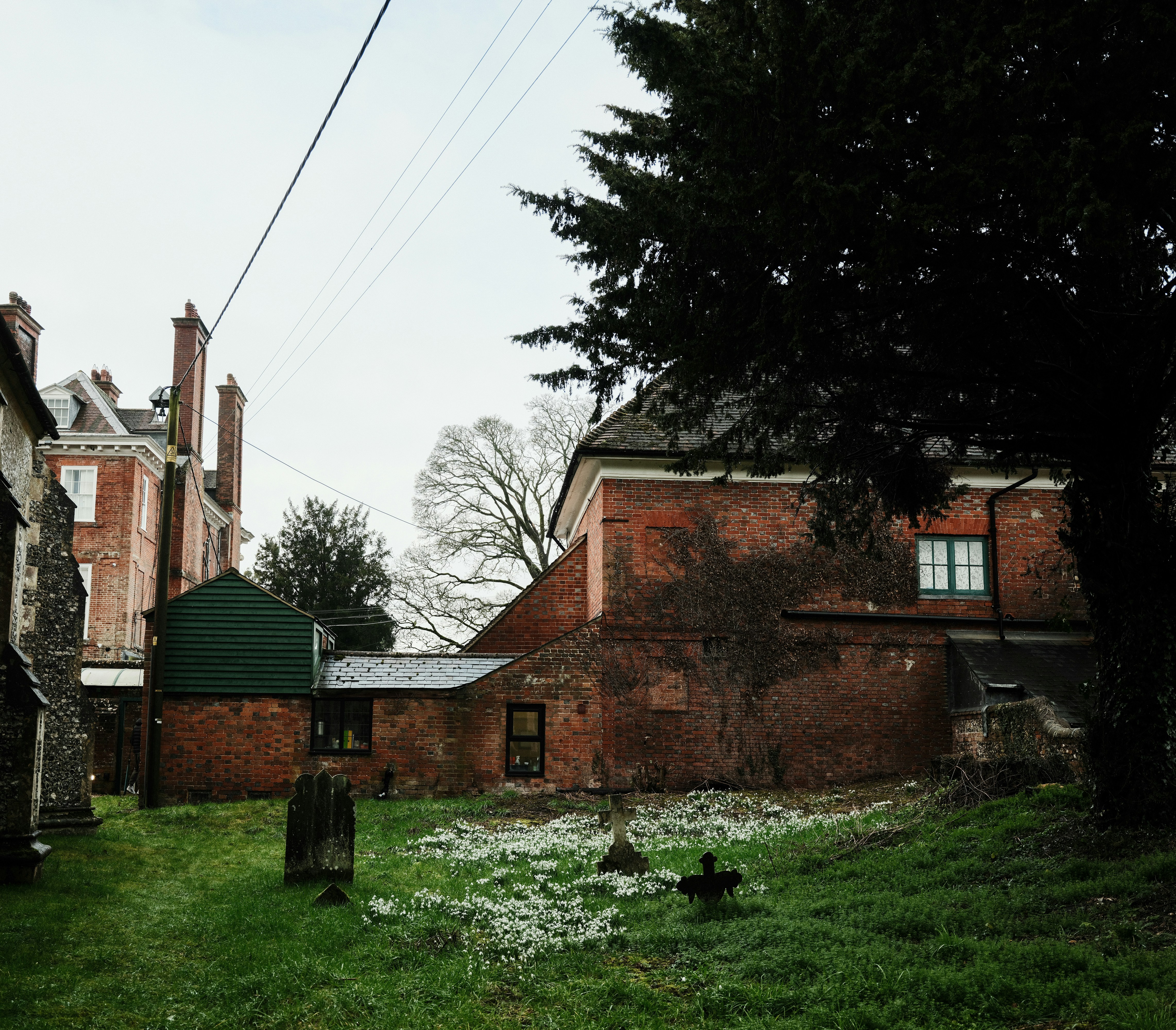 Red Brick Hospice at Dusk: A Quiet Cemetery Courtyard