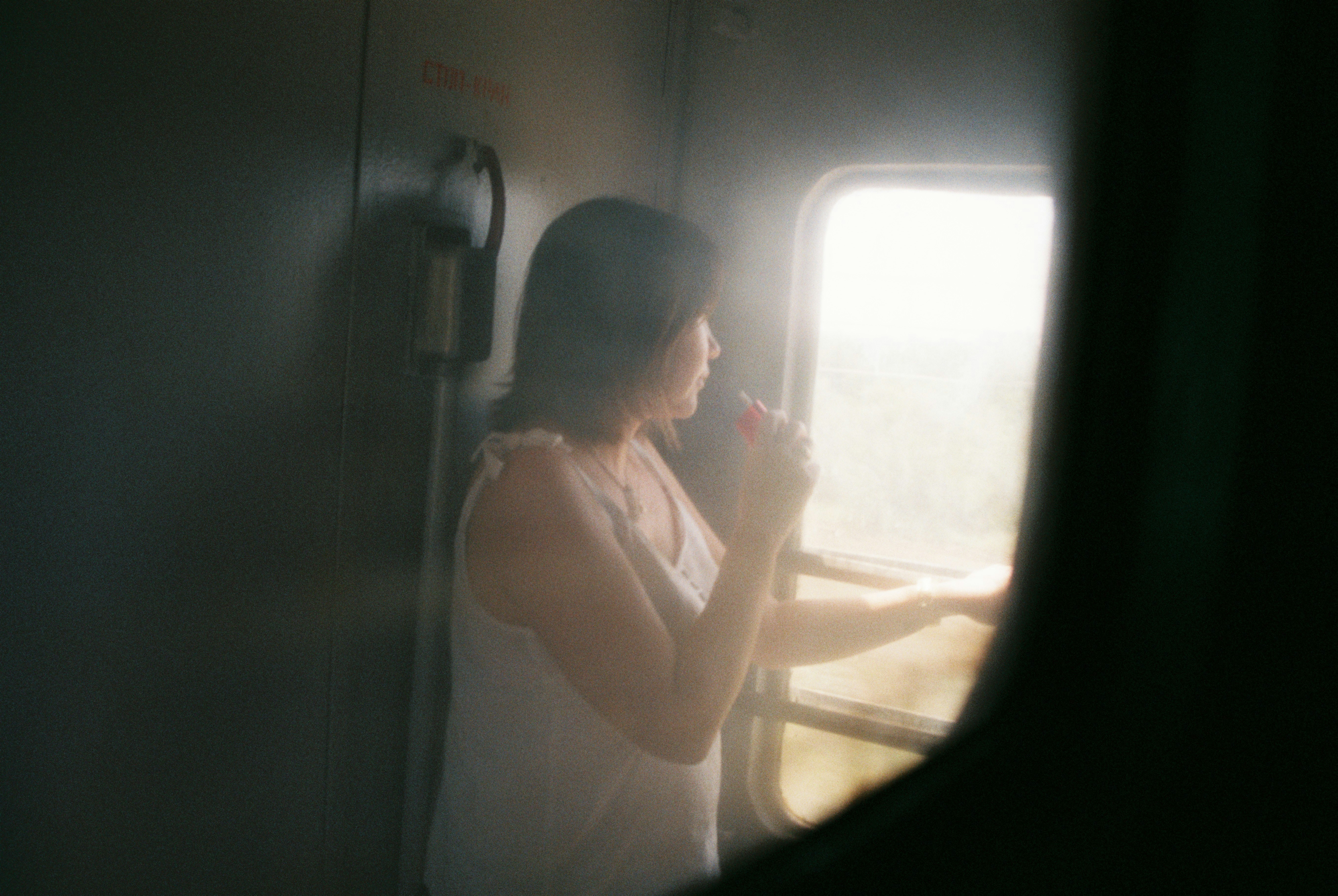 Window-side Moment: Cigarette Break on a Quiet Train