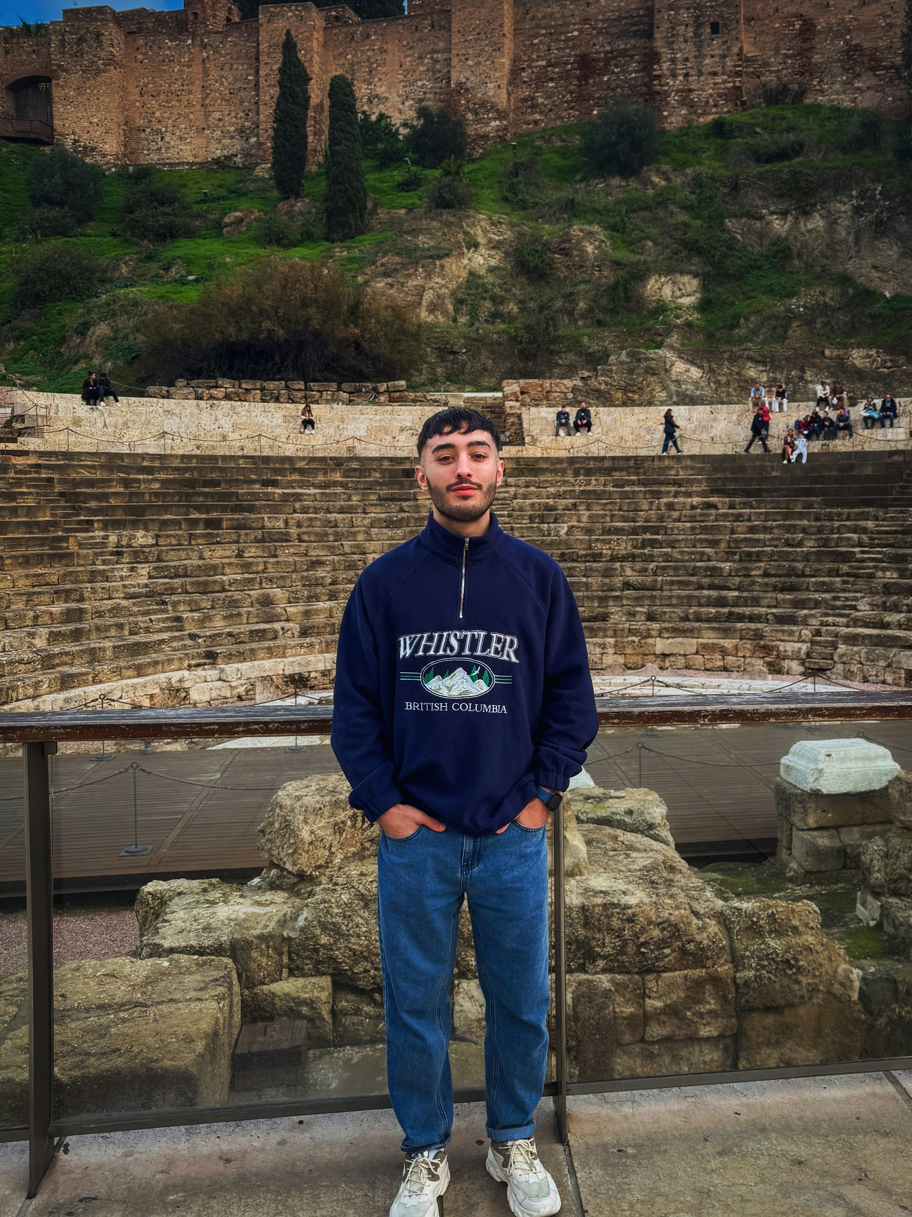 Youth at the Ancient Amphitheater: Quiet Confidence in a Blue Whistler Hoodie