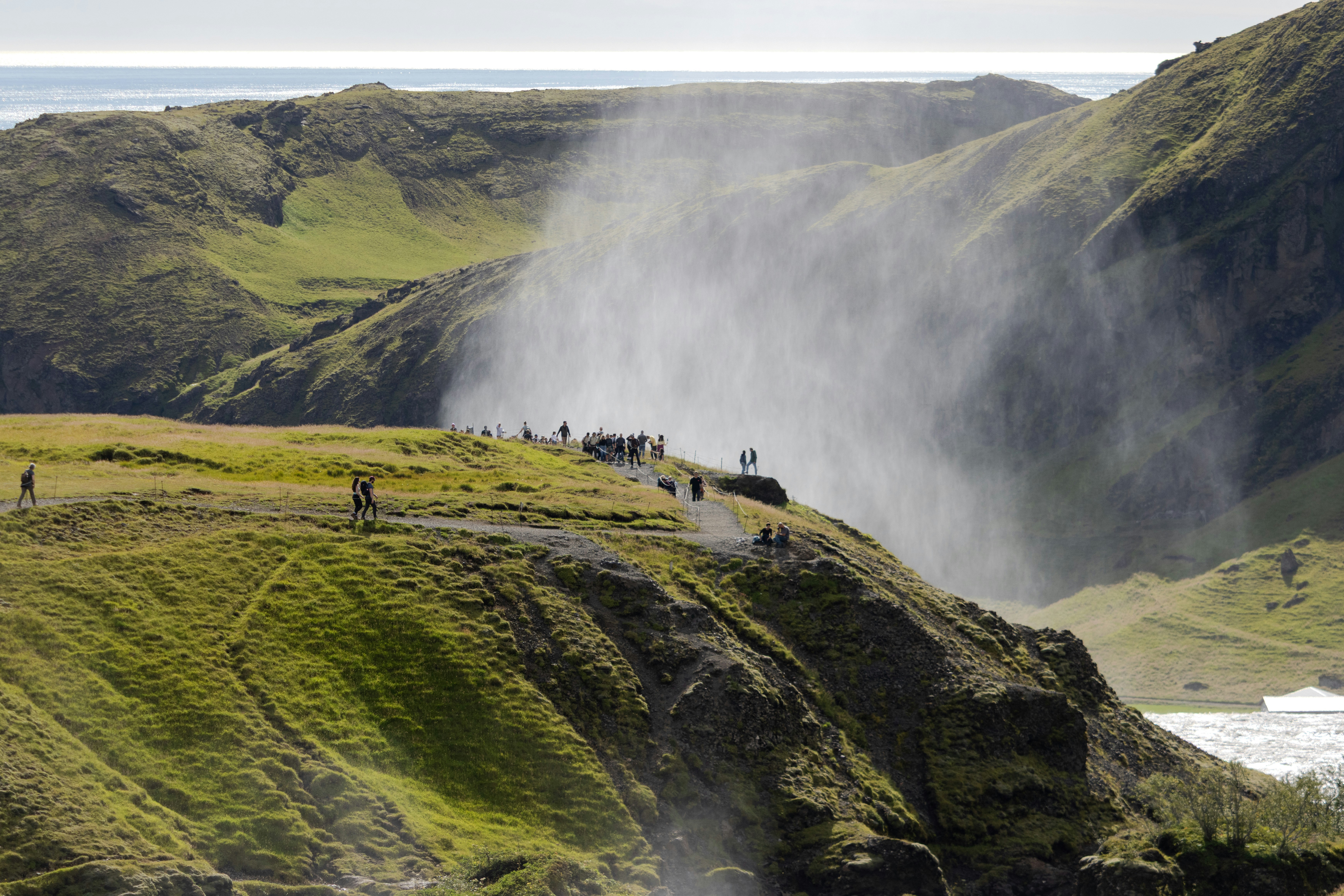 Misty Rim: Trail of Visitors Along a Cliff Edge