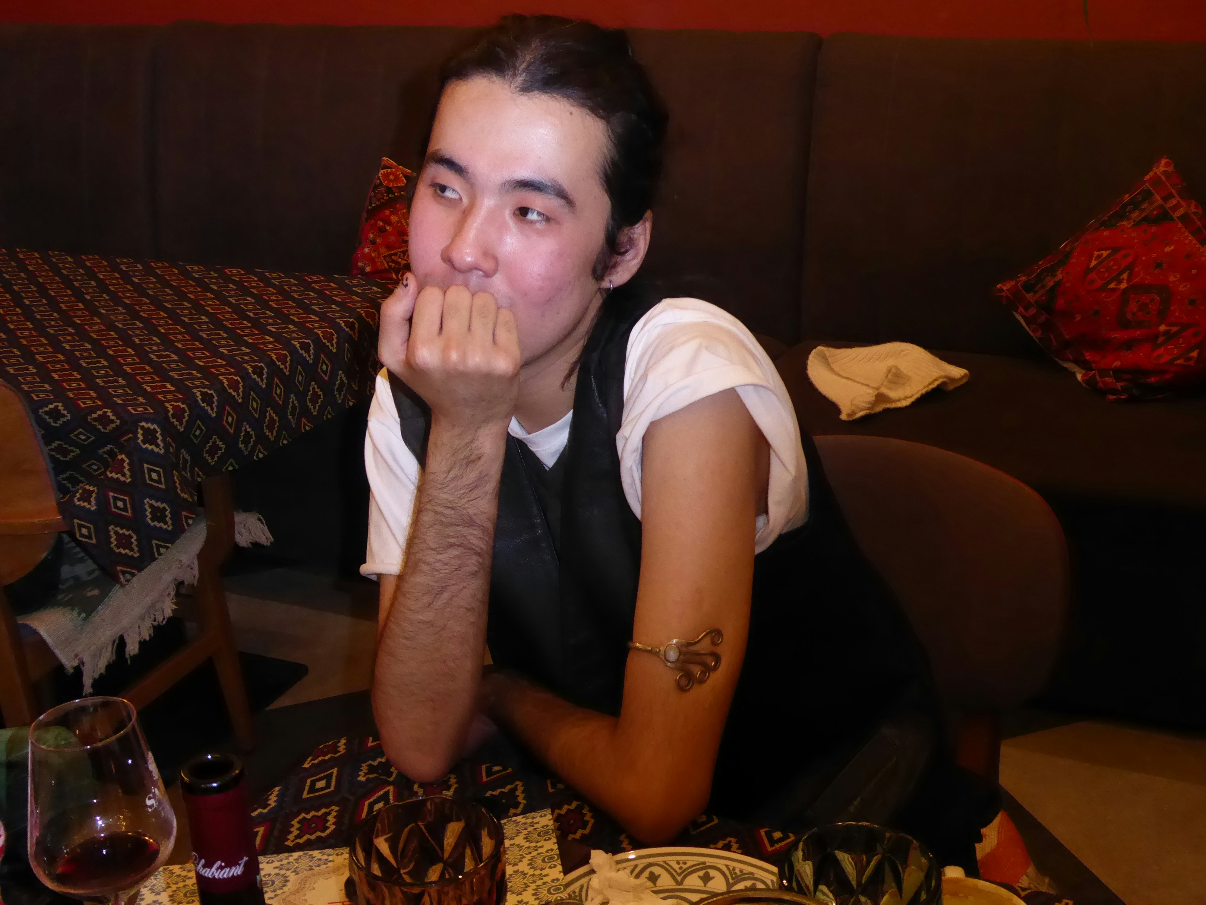 Man with hand on chin looking away thoughtfully