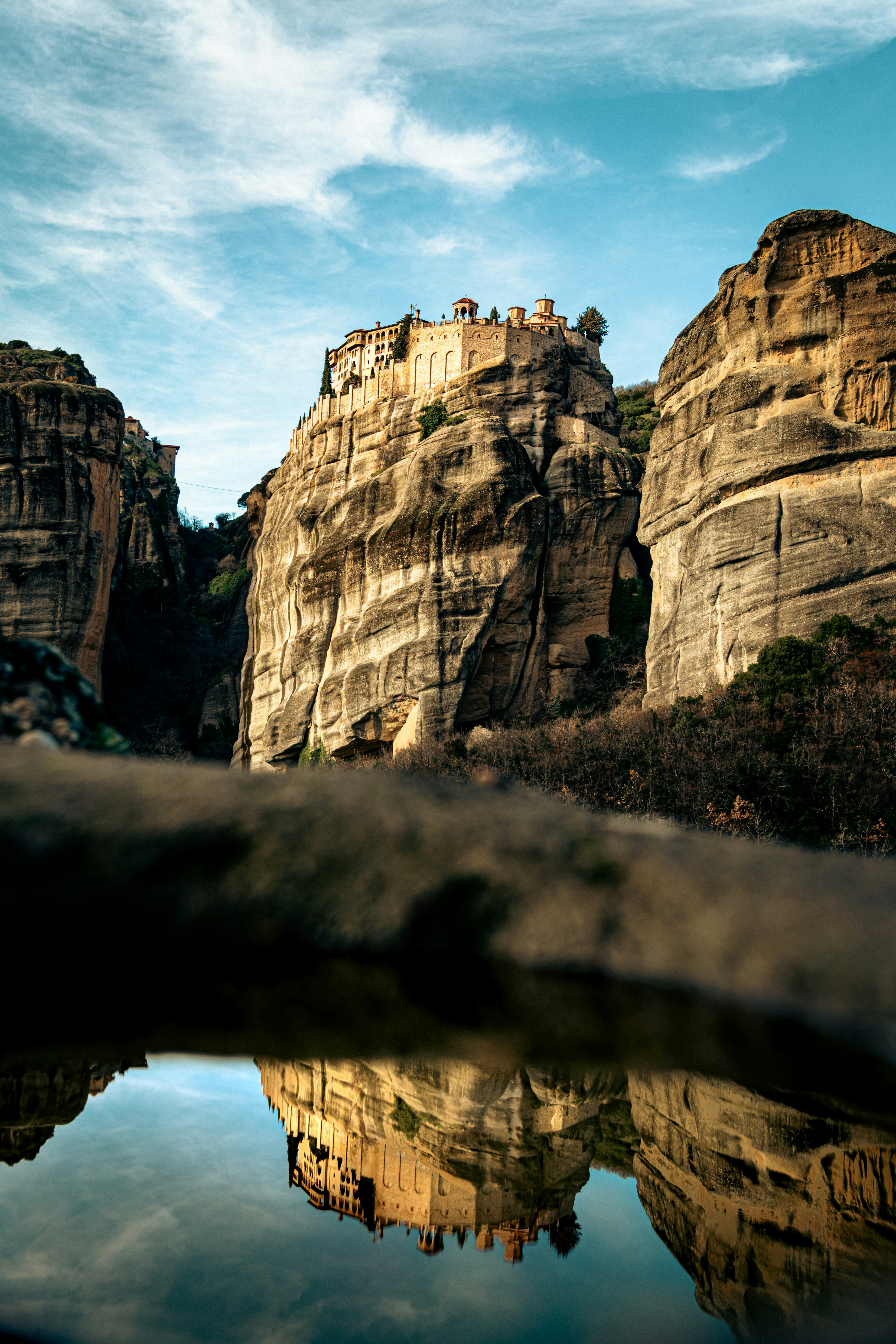 Monolithic monastery perched above carved sandstone cliffs