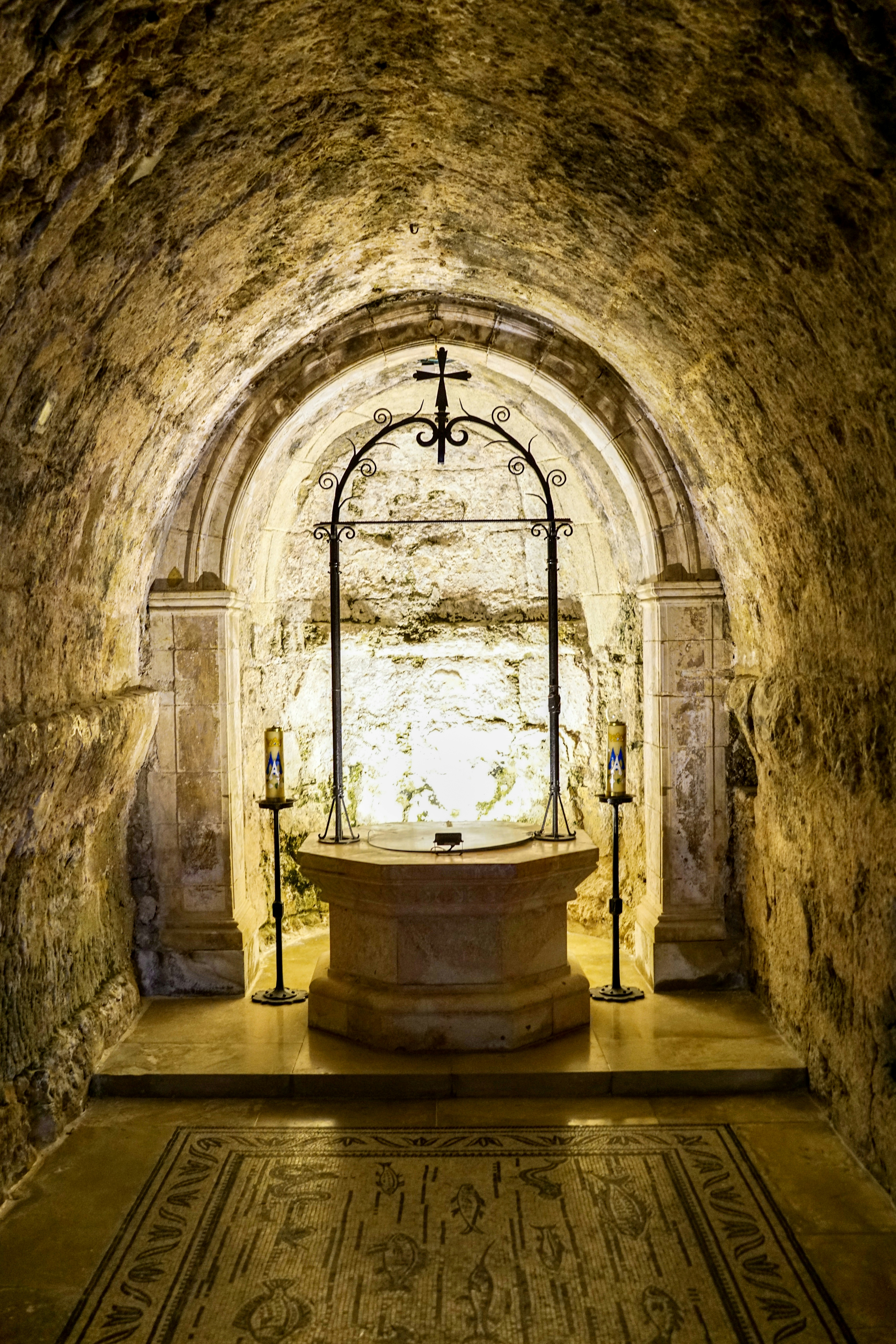 Candlelit Chapelle: A Stone Altar Beneath Cold Arches