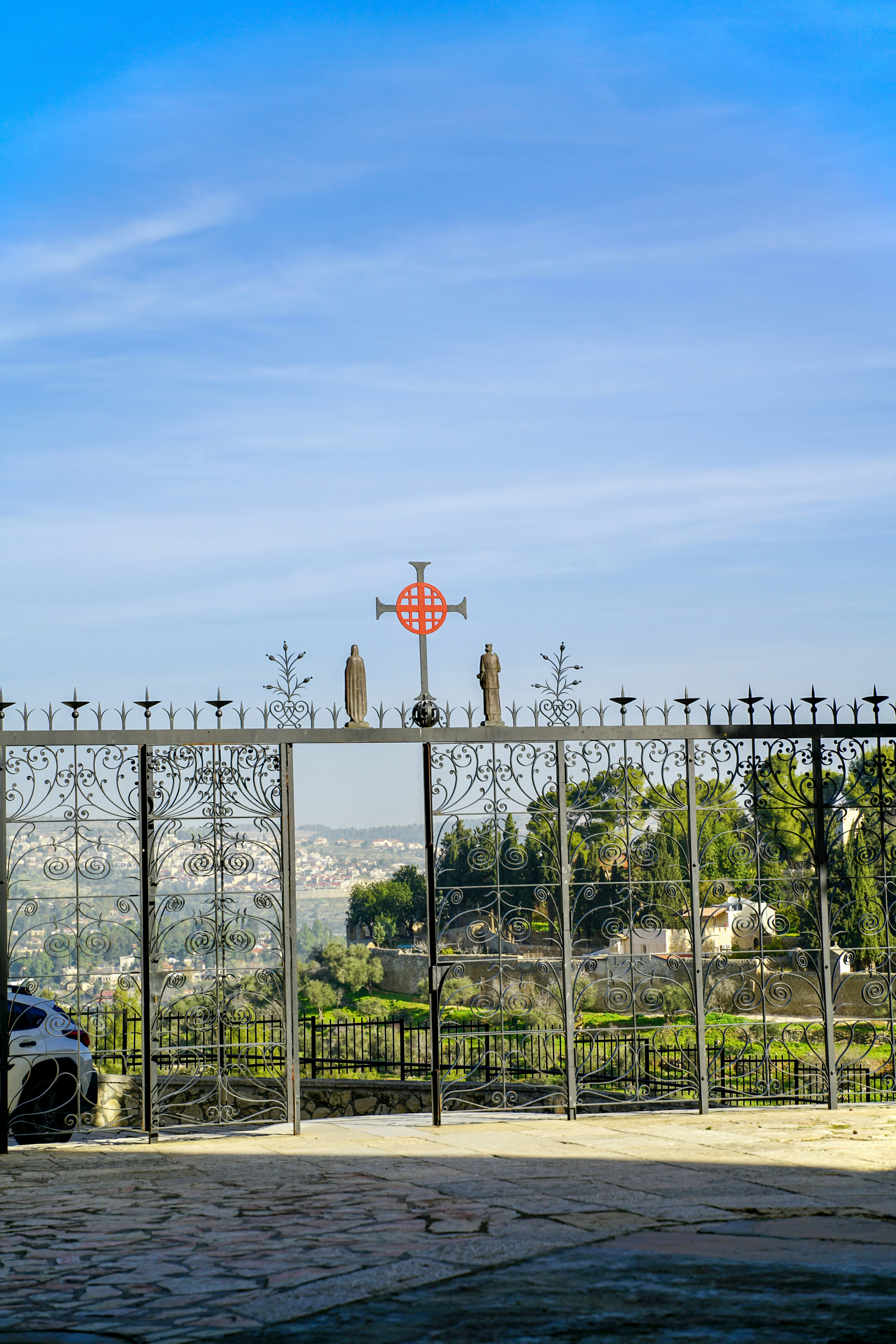 Gate to the Valley: Ornate Ironwork Framing a City Vista