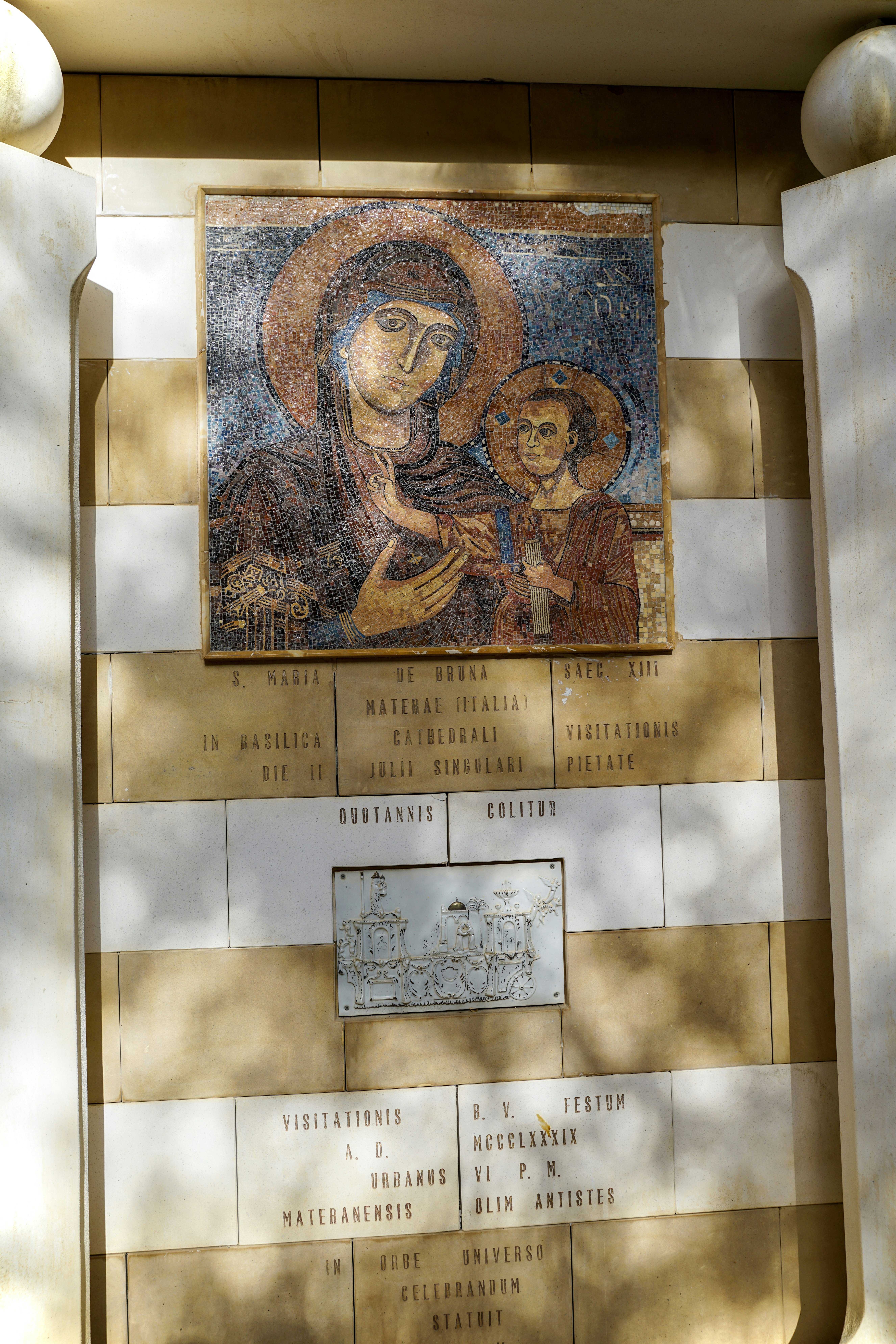 Mosaic Madonna: Sacred Icon Framed in Sunlit Architecture