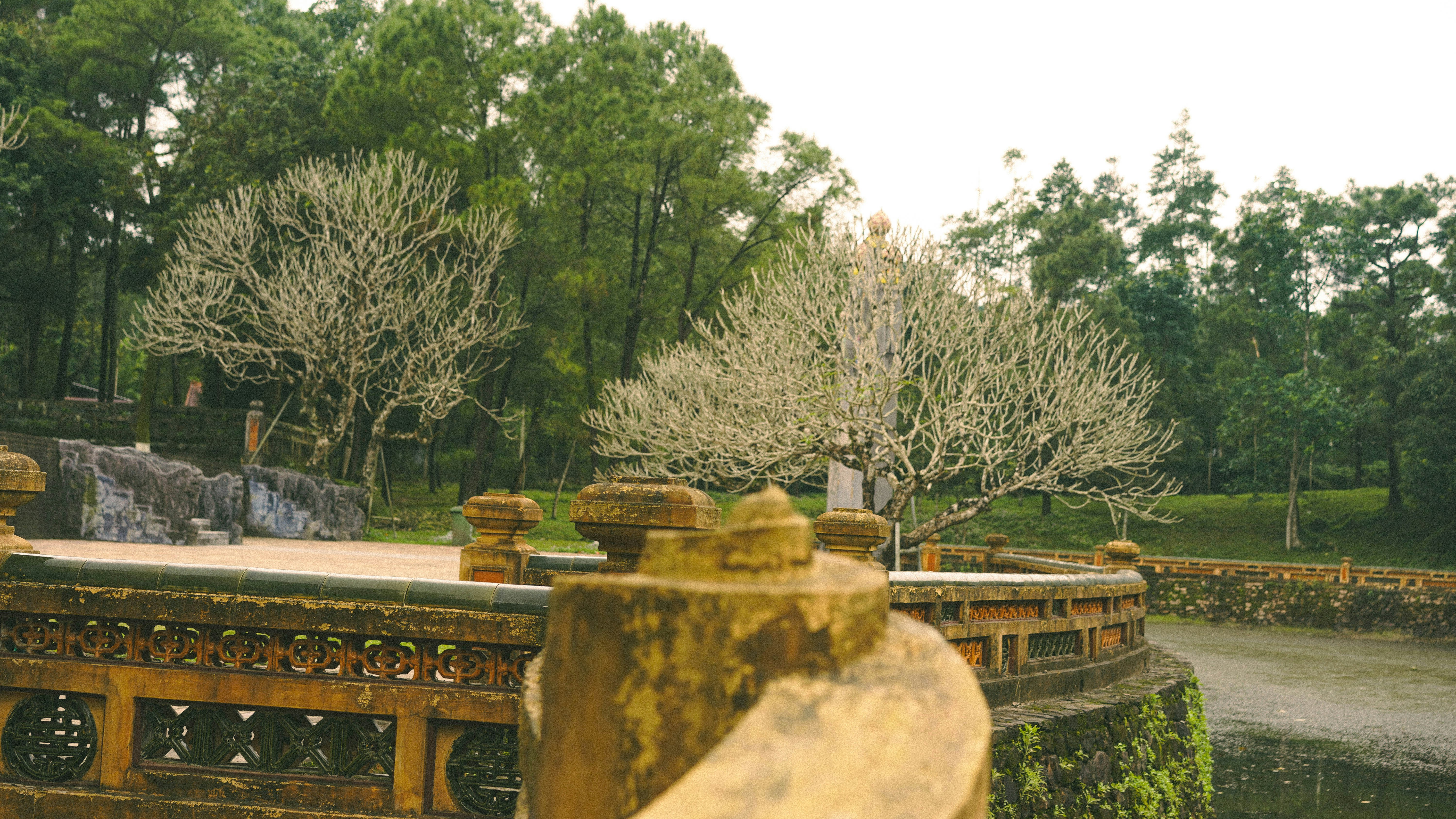 Stone Balcony Vista: Mossed Rail and Waterfall Fragments