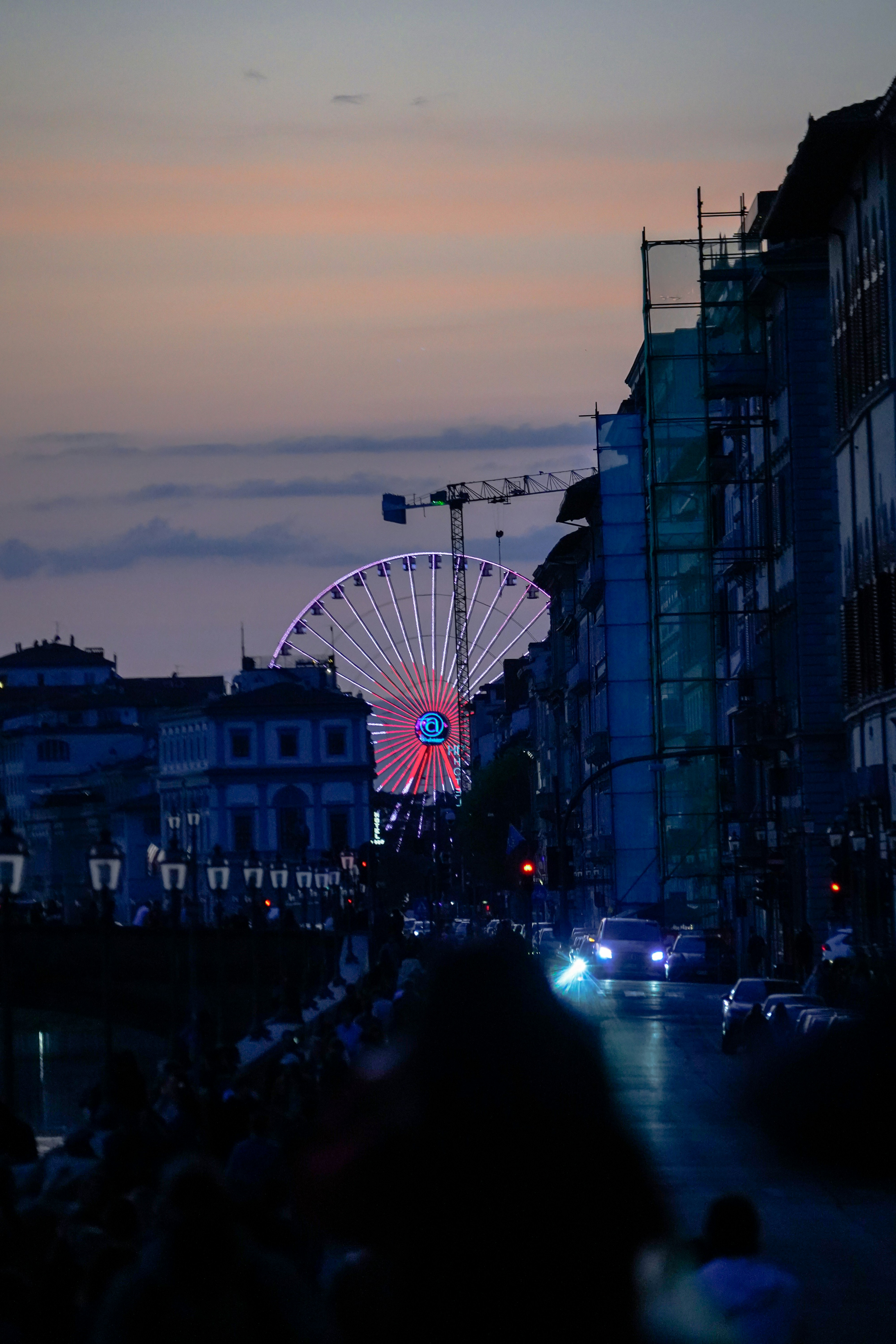 Neon Wheel at Dusk: A City Street Gathers Light