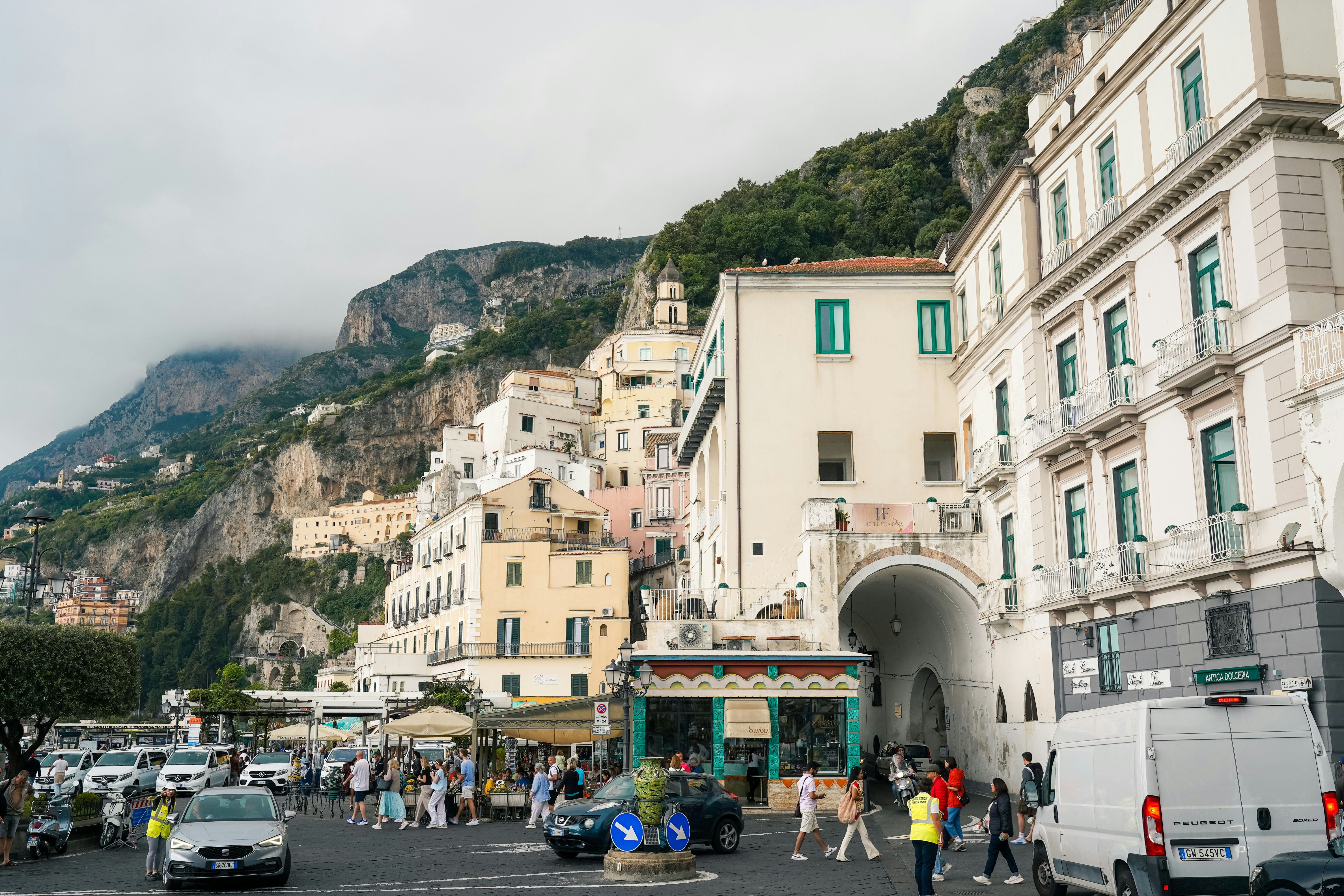 Colorful Amalfi Front: A Bustling Piazza Framed by Cliffside Villages