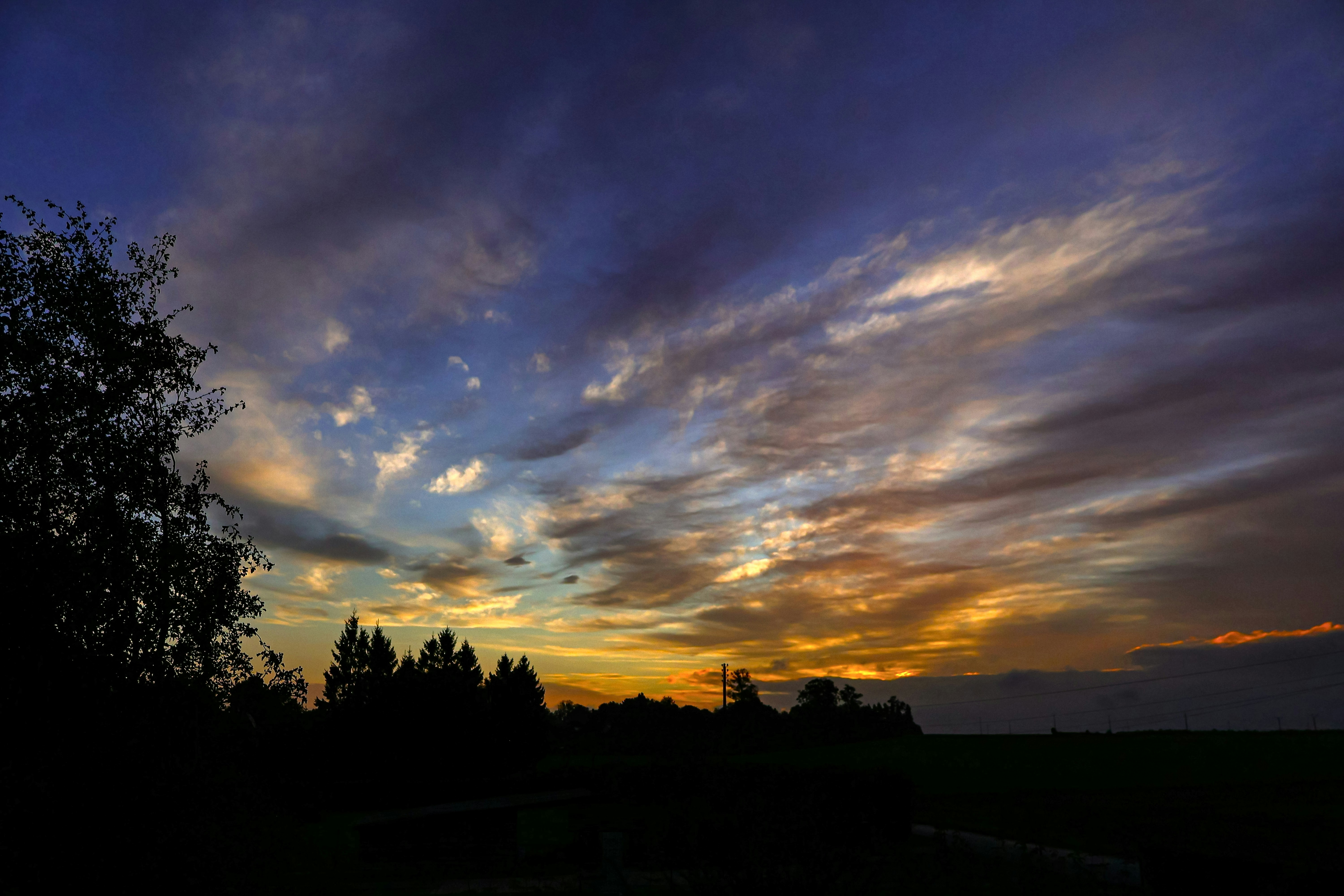 Dusk Over a Silhouette: Skyfire on the Horizon