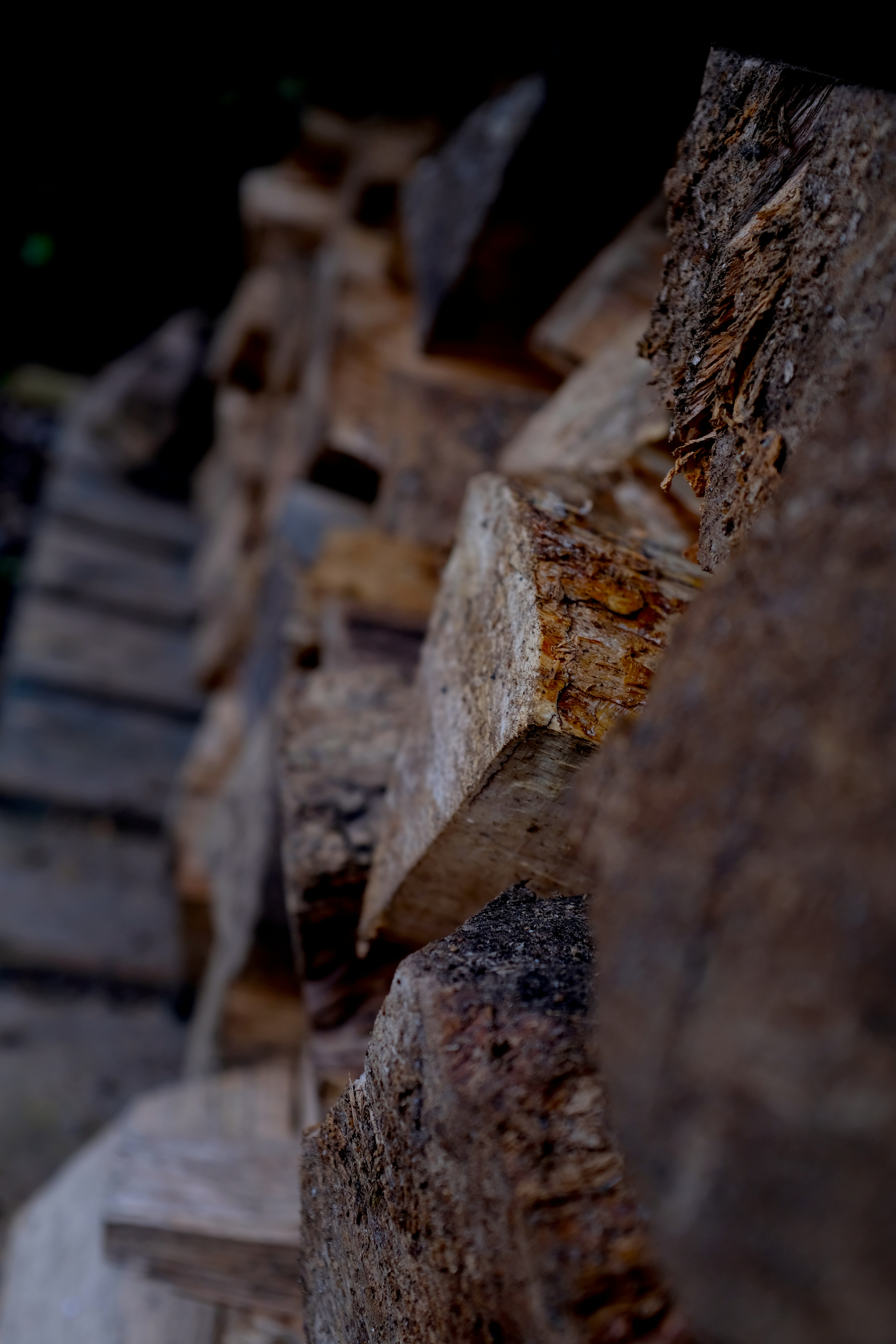 Stacked Firewood: Rough Texture and Quiet Depth