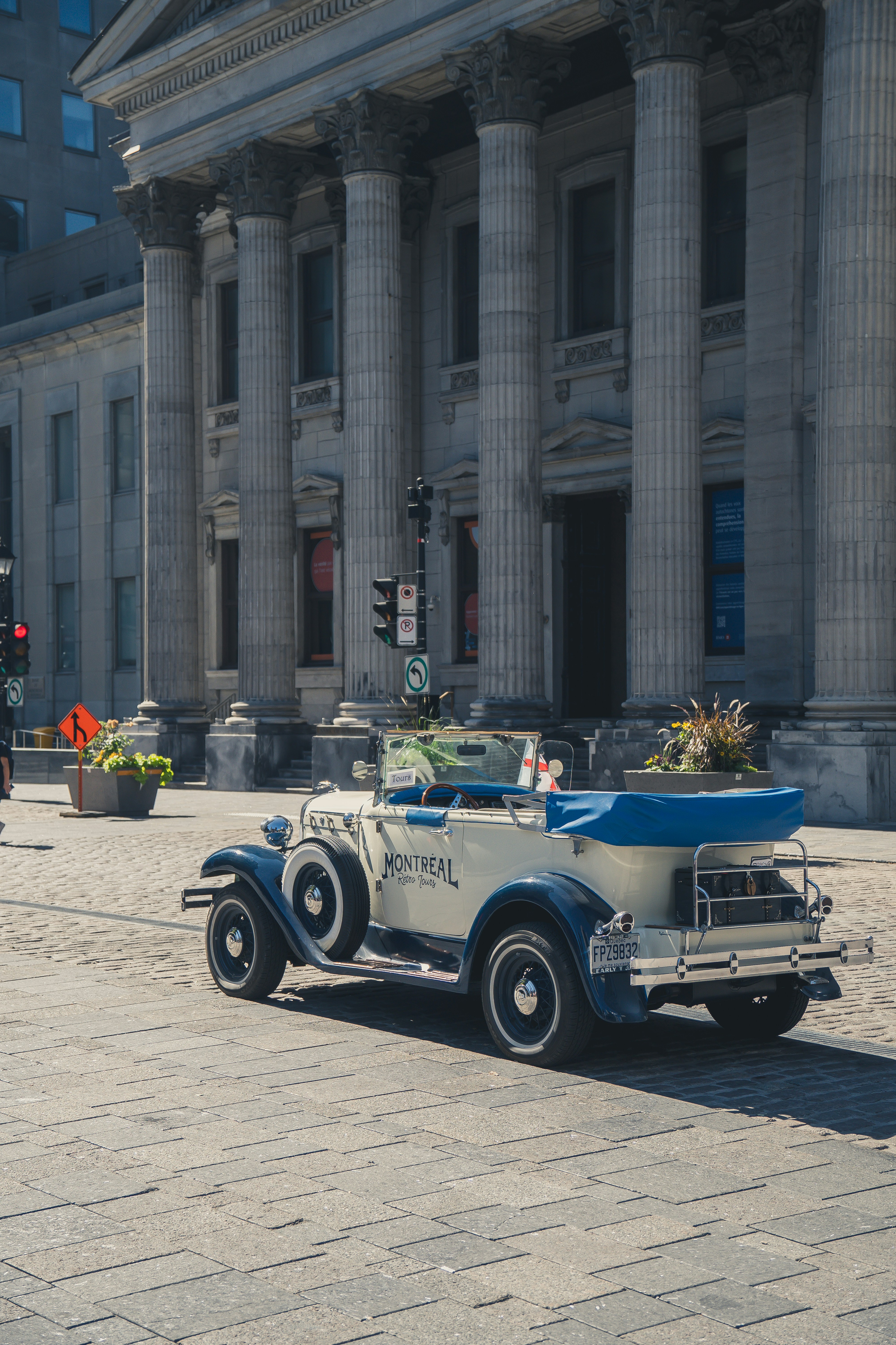 Vintage Montreal Car Beneath Grand Facade