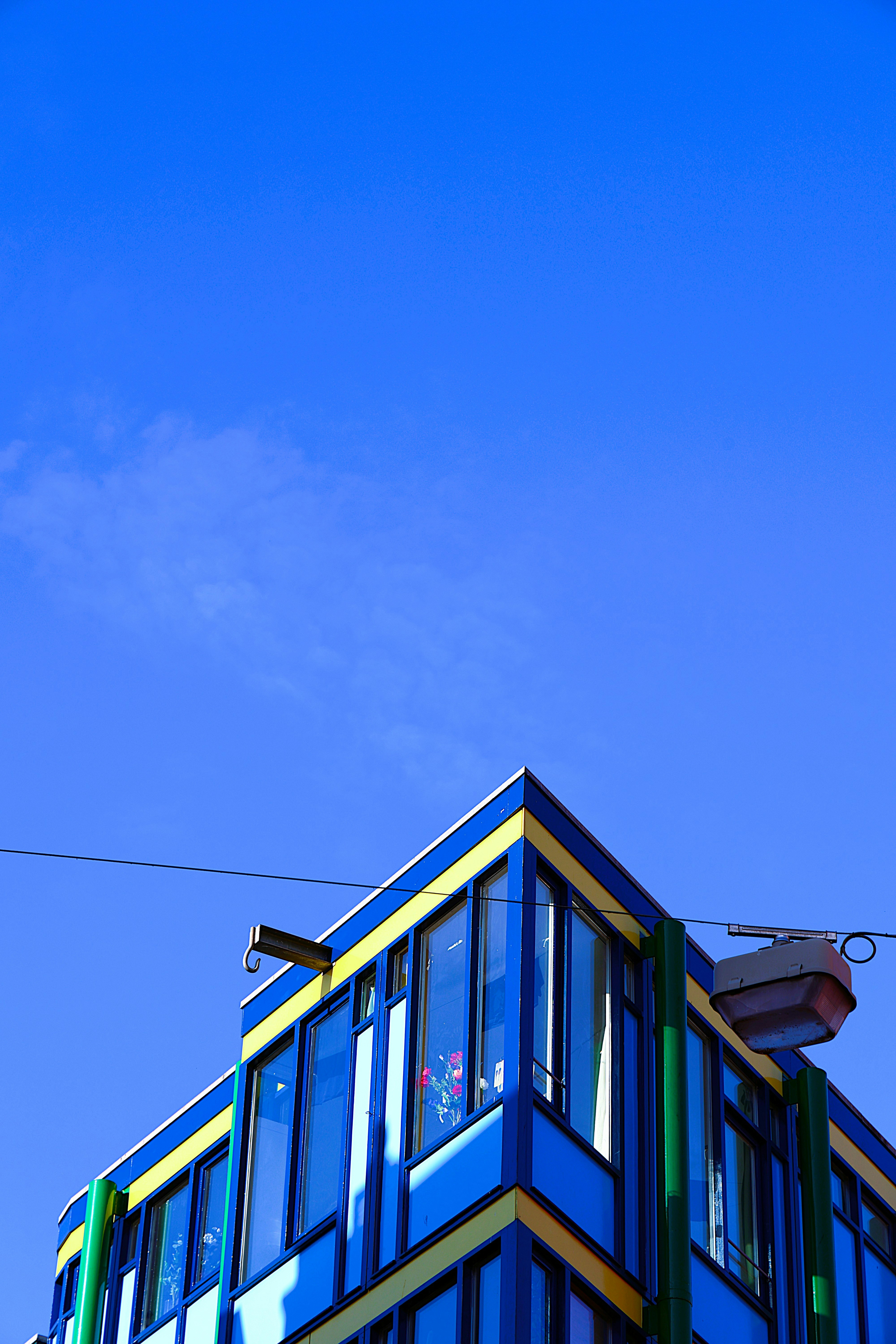 Chromatic Edge: A Corner of Colorful Architecture Beneath a Blue Sky