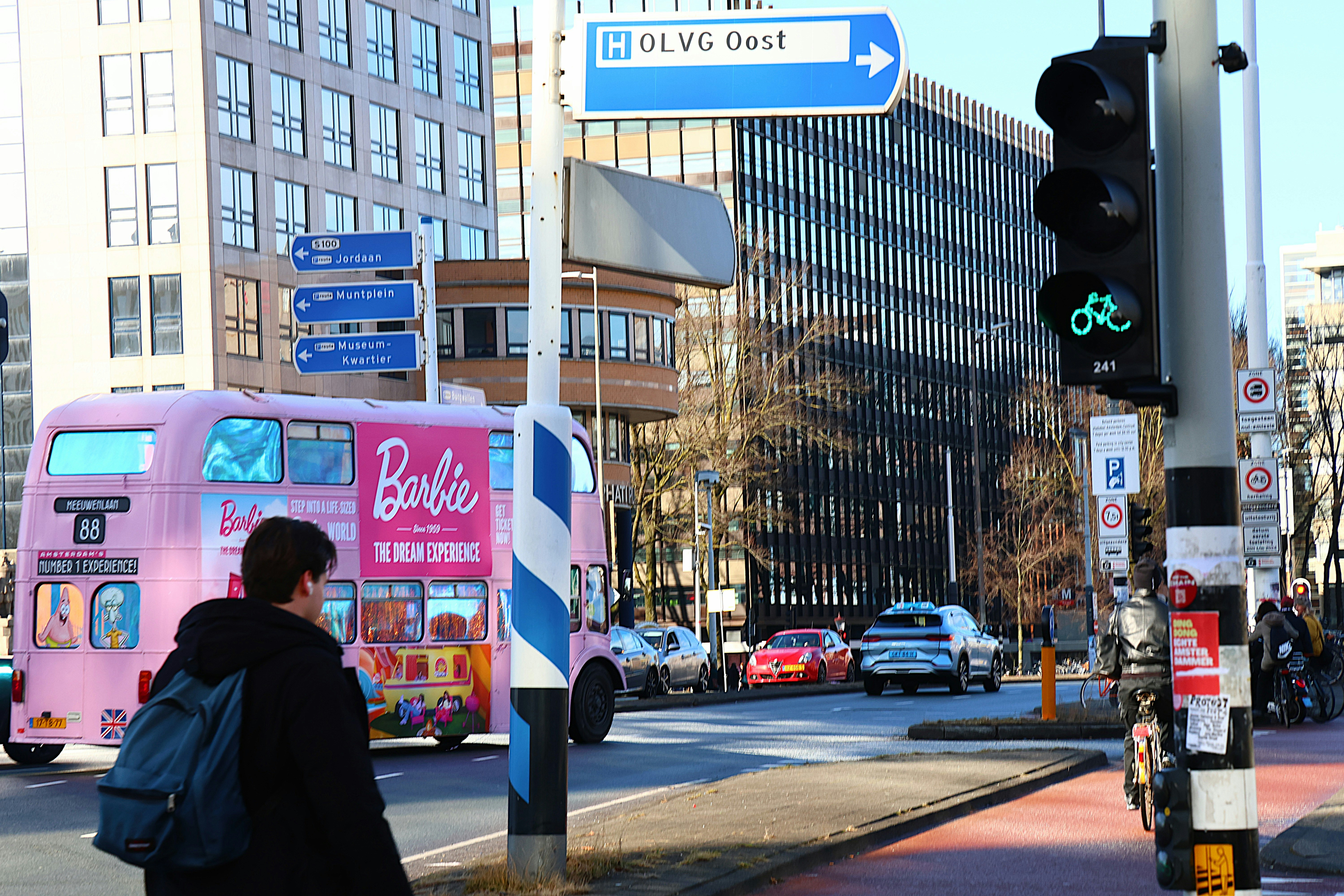 Barbie Bus and City Pulse: A Busy Street Scene in Motion