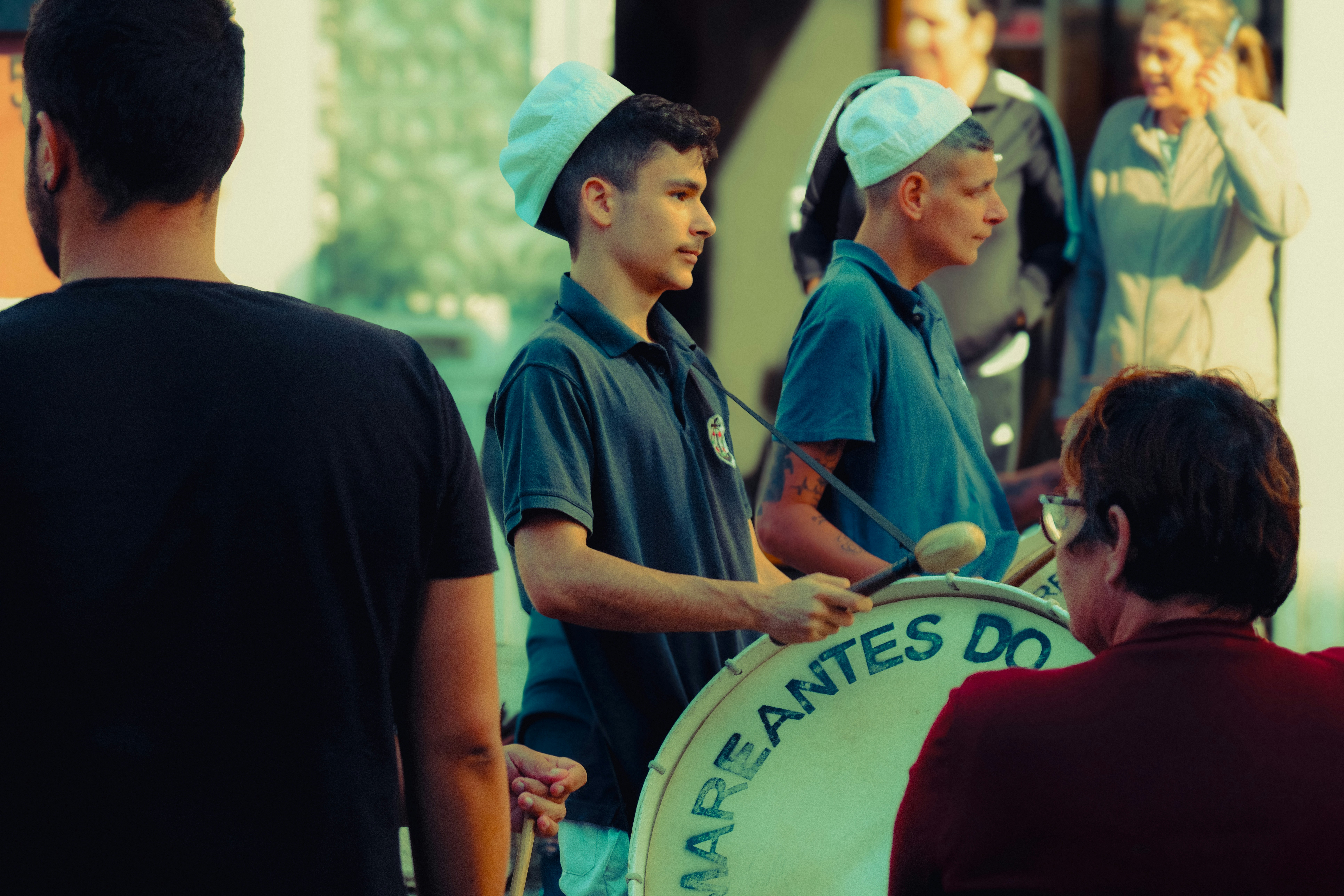 Drums and Focus: A Band Member in Blue Cap Steers the Parade