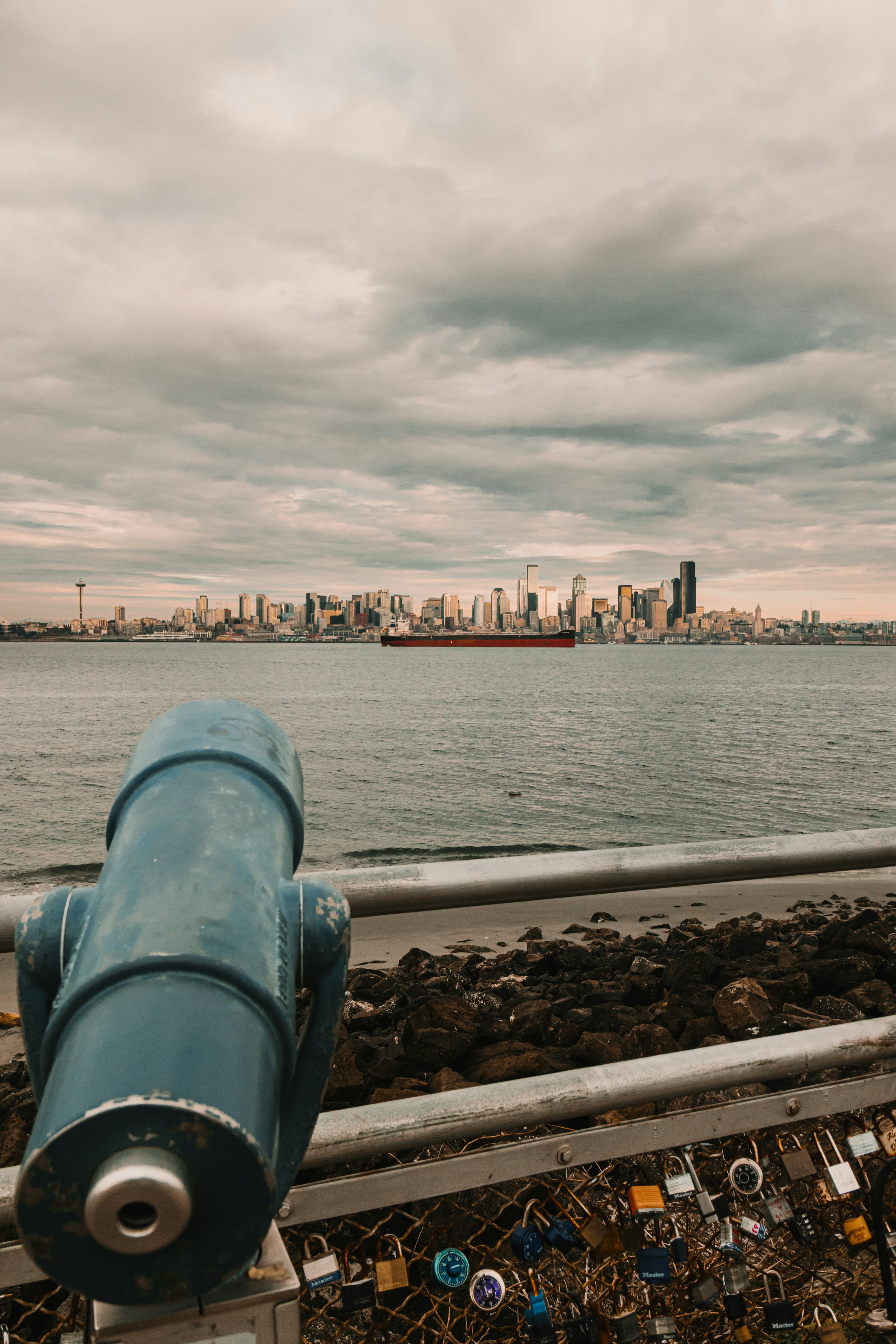 Overlooked Harbor: A Cityscape Framed by a Coastal Cannon