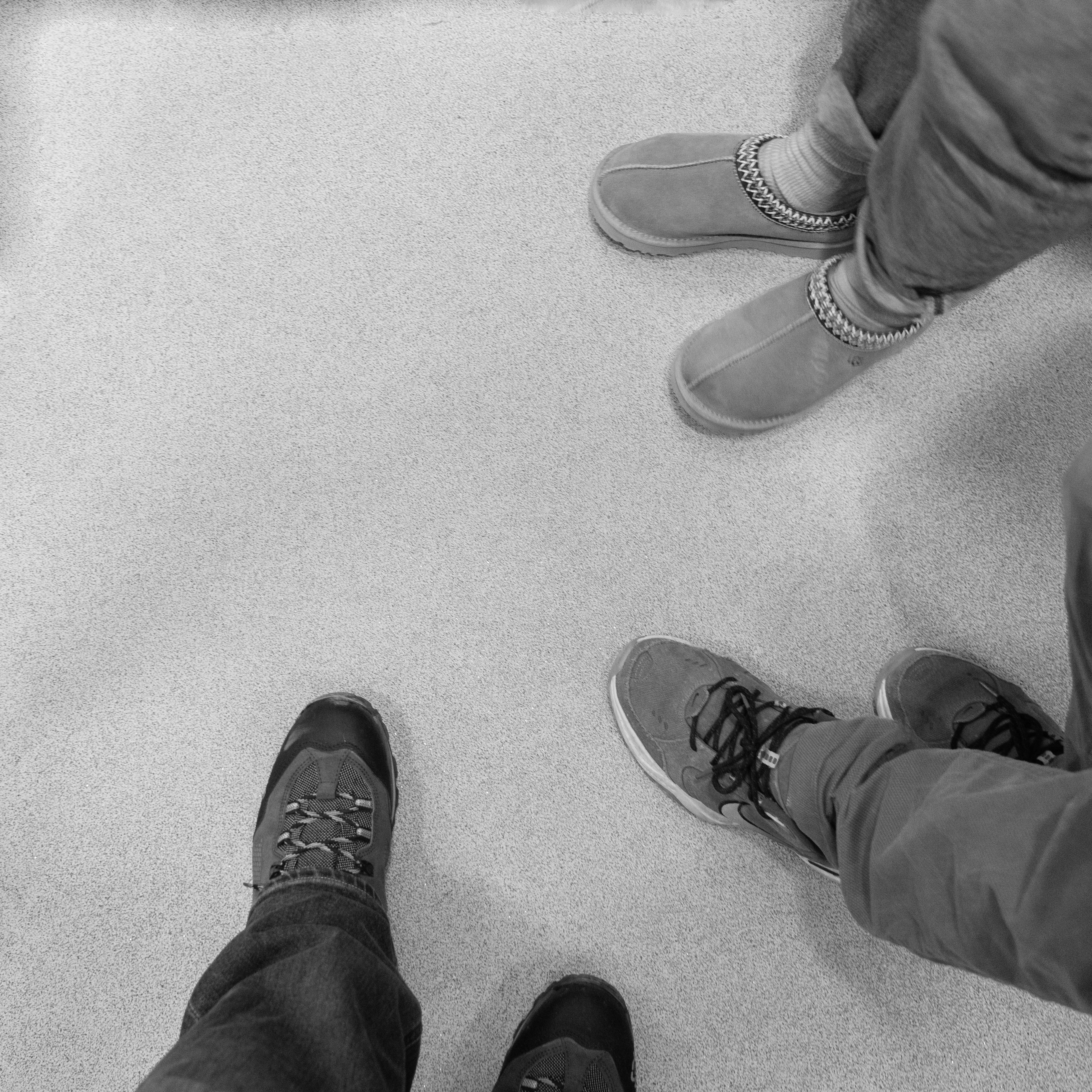 Circle of Steps: A Bar of Feet Meeting in monochrome