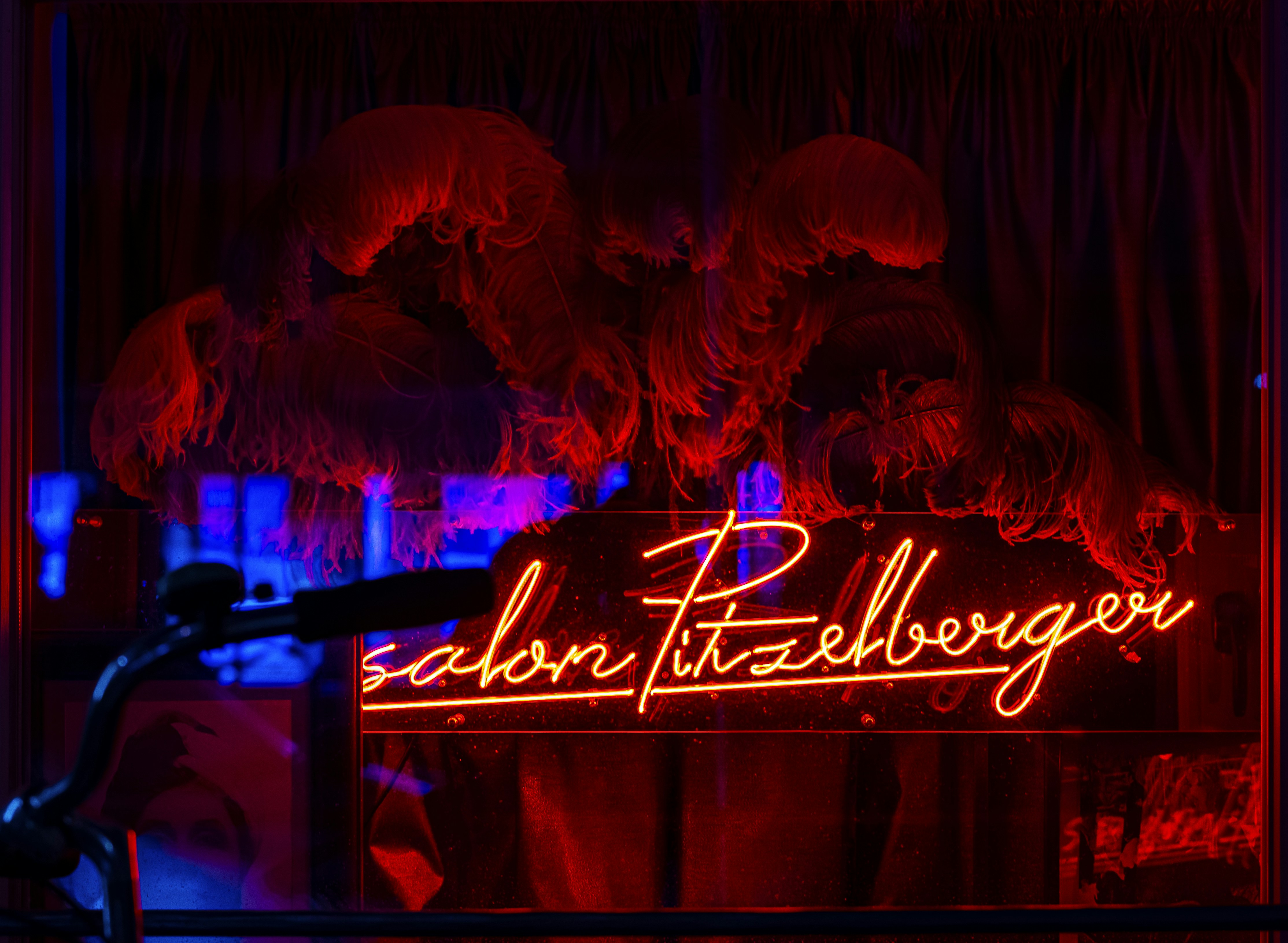 Neon Crimson & Velvet: A Portrait Behind the Sign