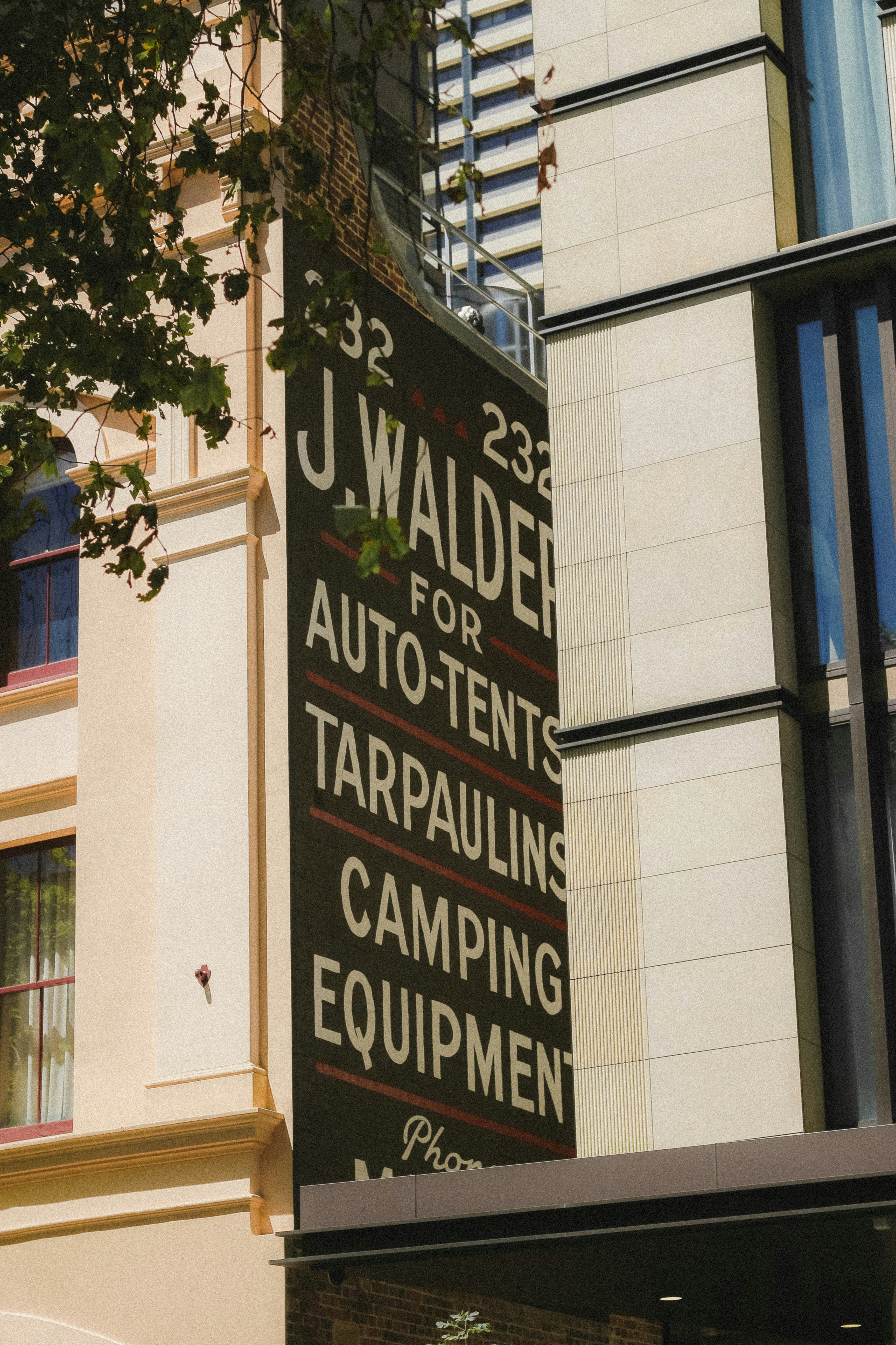 Signboard Leaning into the Street: J. Walden Auto-Tents and Camping Equipment