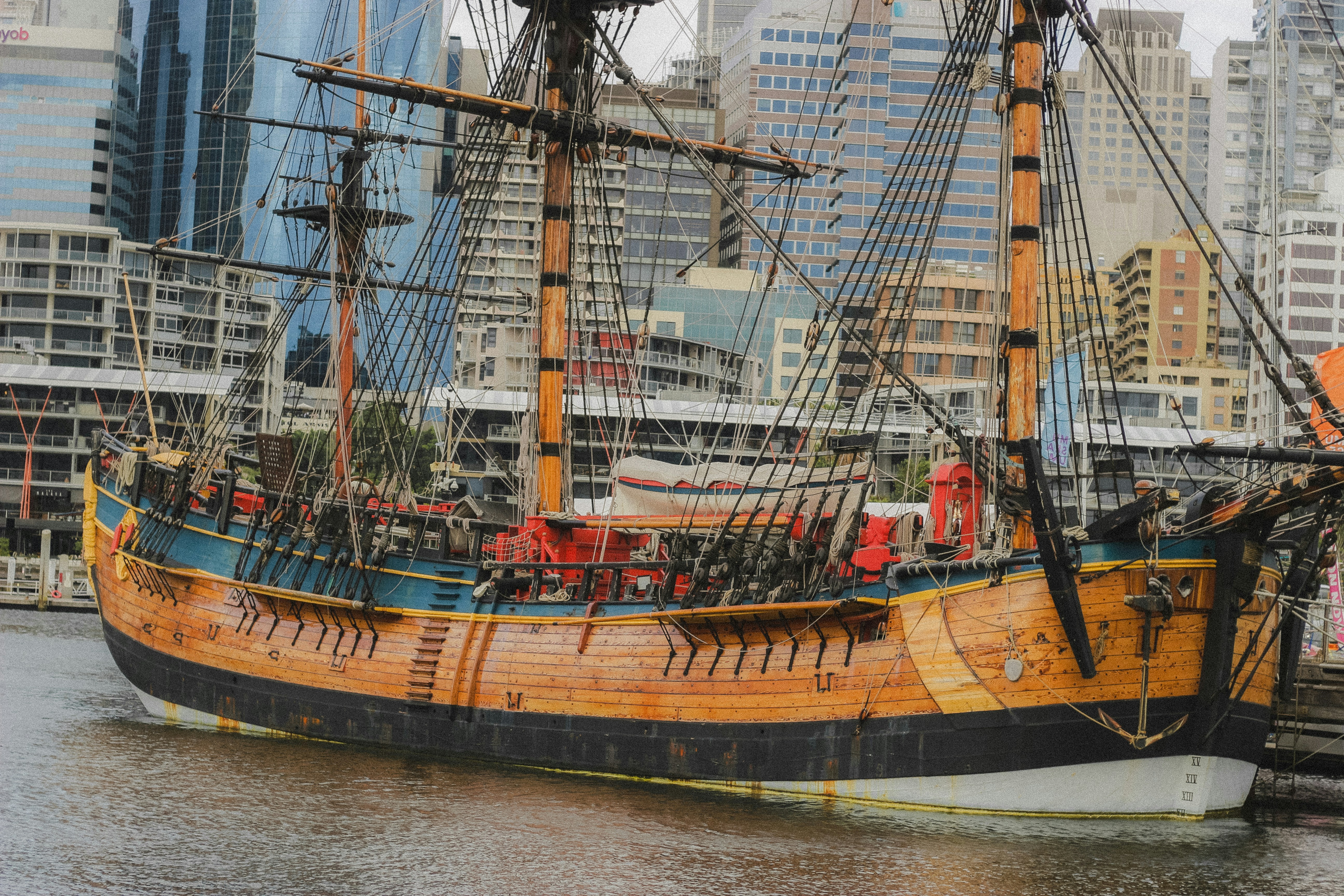 Harbor Schooner at Dawn: A City Backdrop Returns the Wave