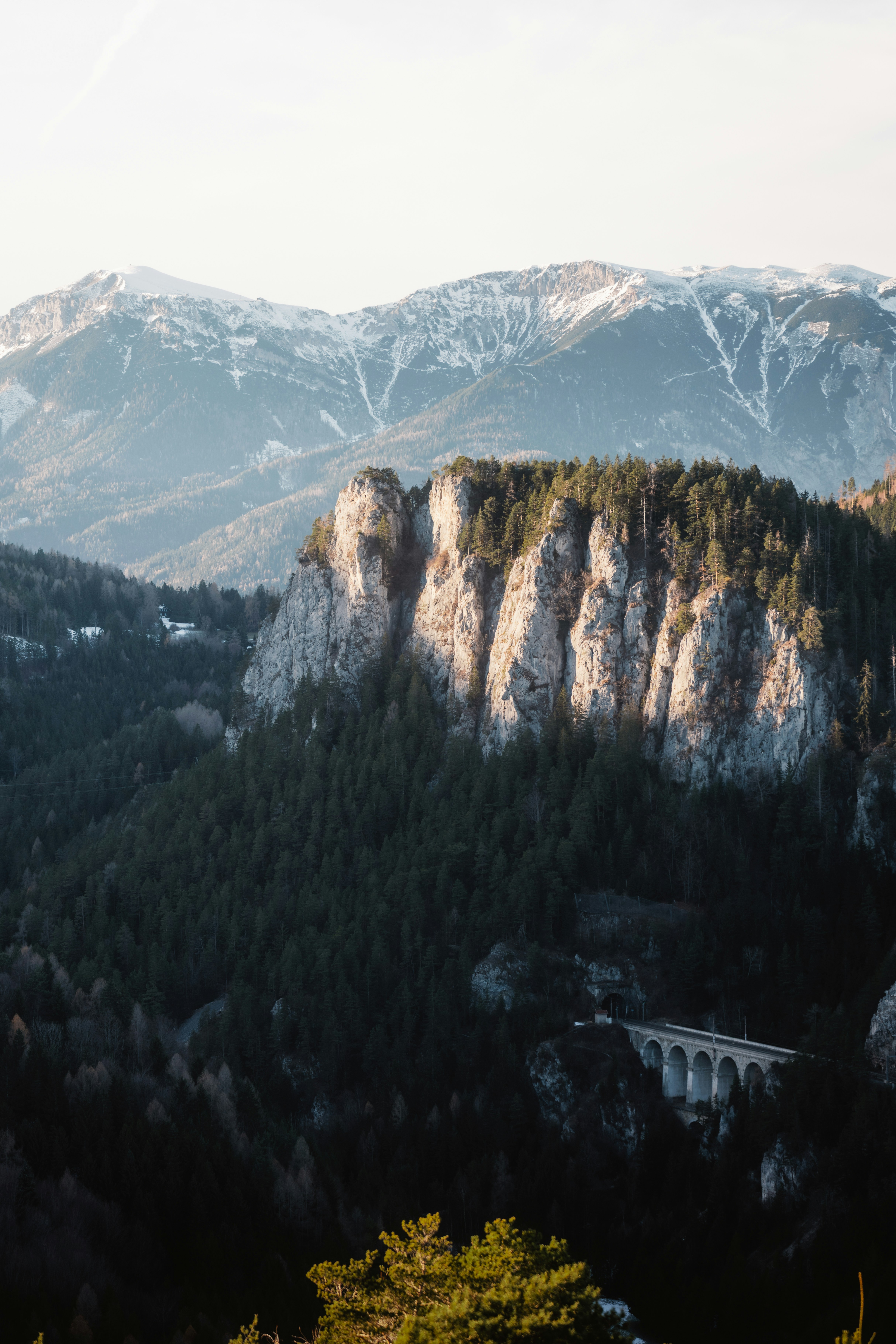 Cliff Edge Over Alpine Valley with Rail Bridge