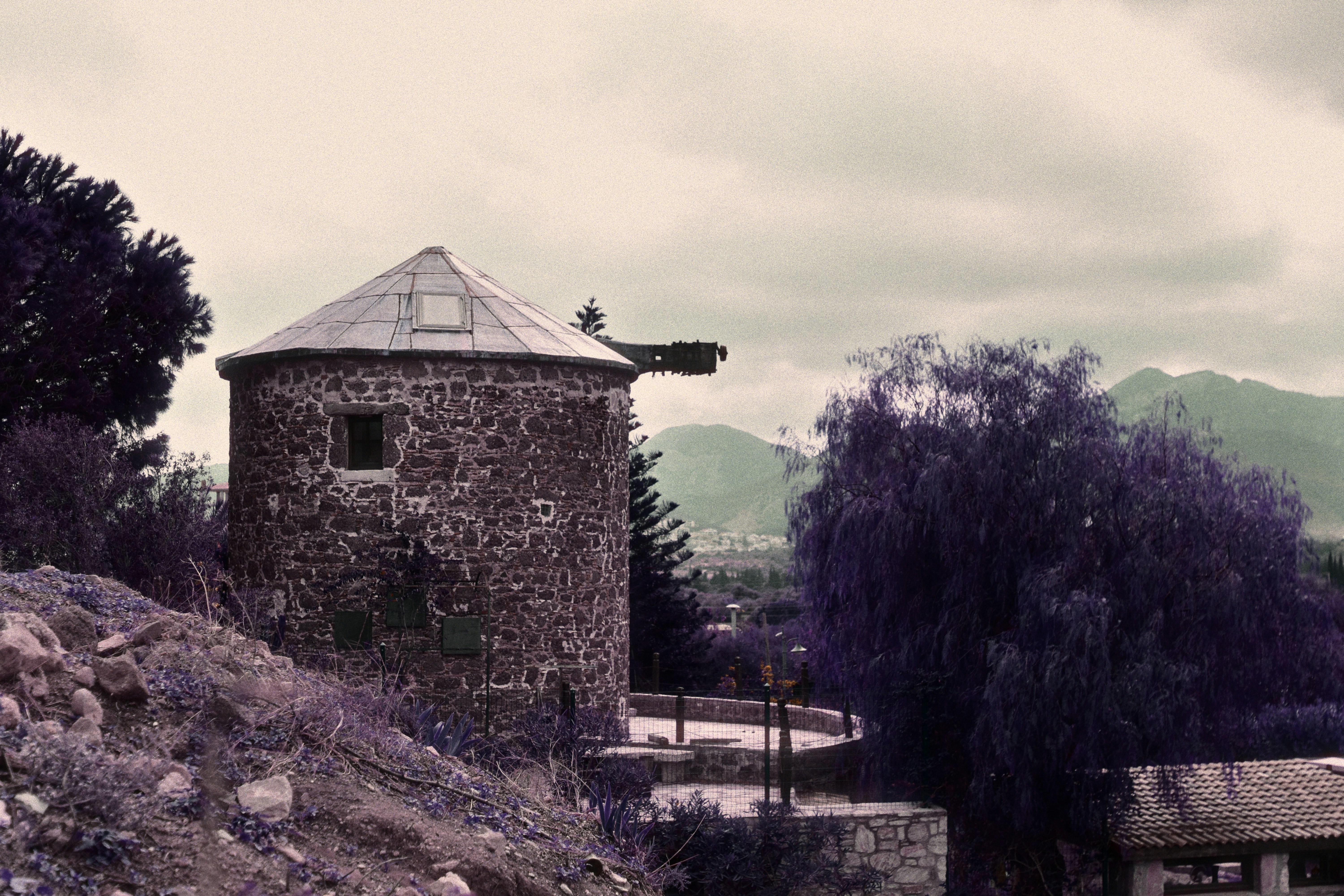 Stone Windmill at Dusk: A Quiet Outpost above the Valley