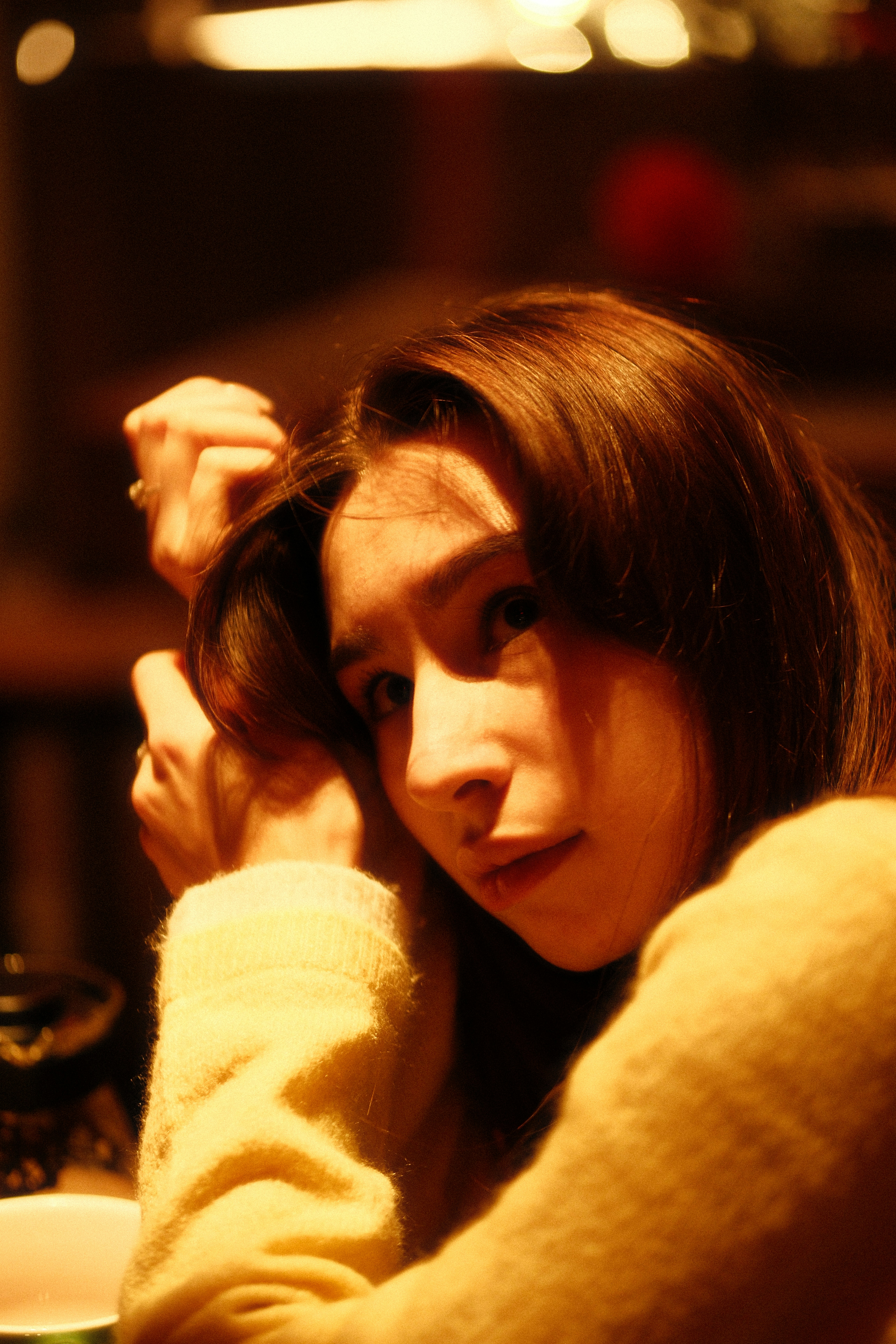 Intimate Portrait Under Warm Bar Lighting