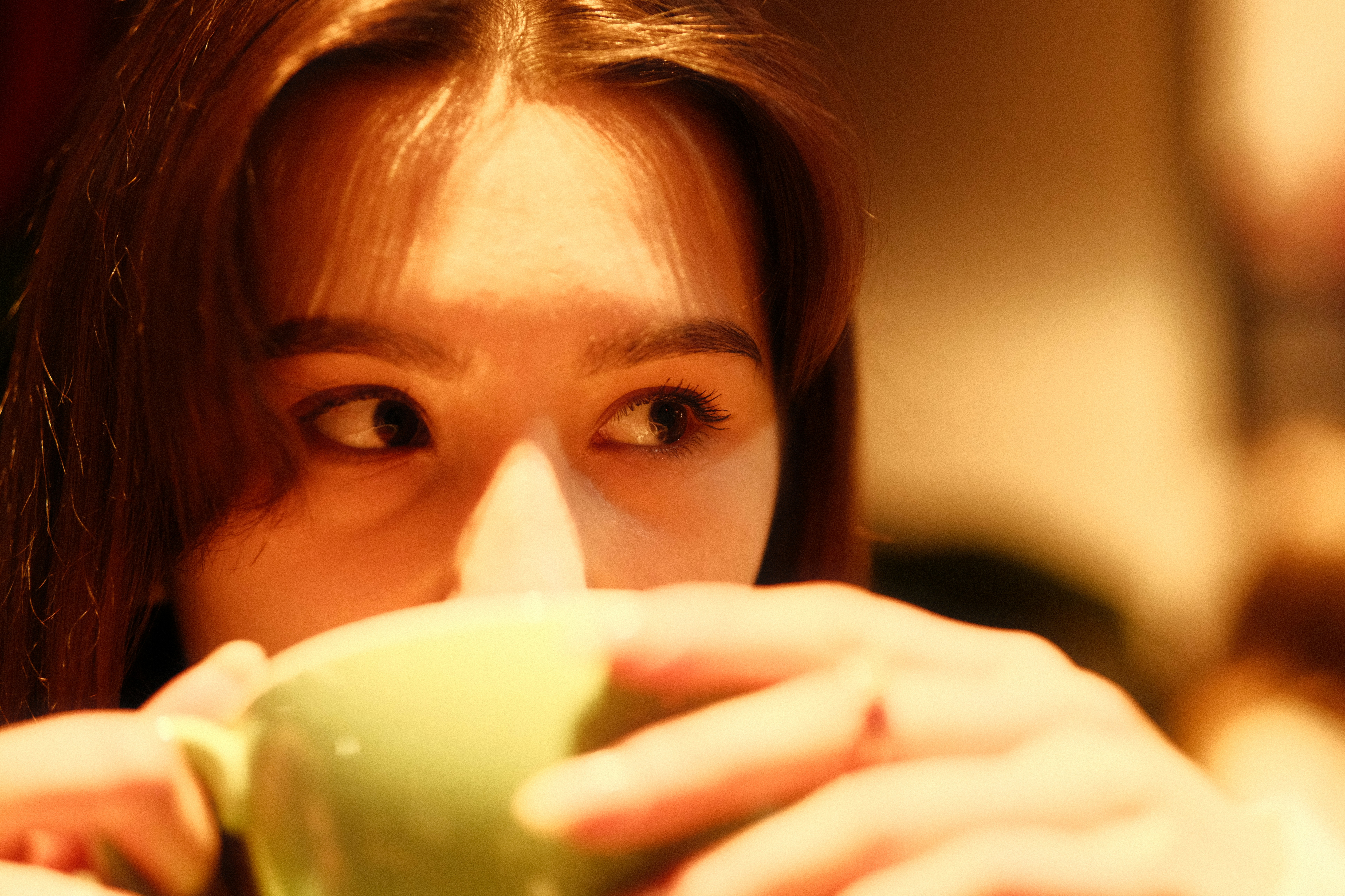 Warm gaze over a steaming cup