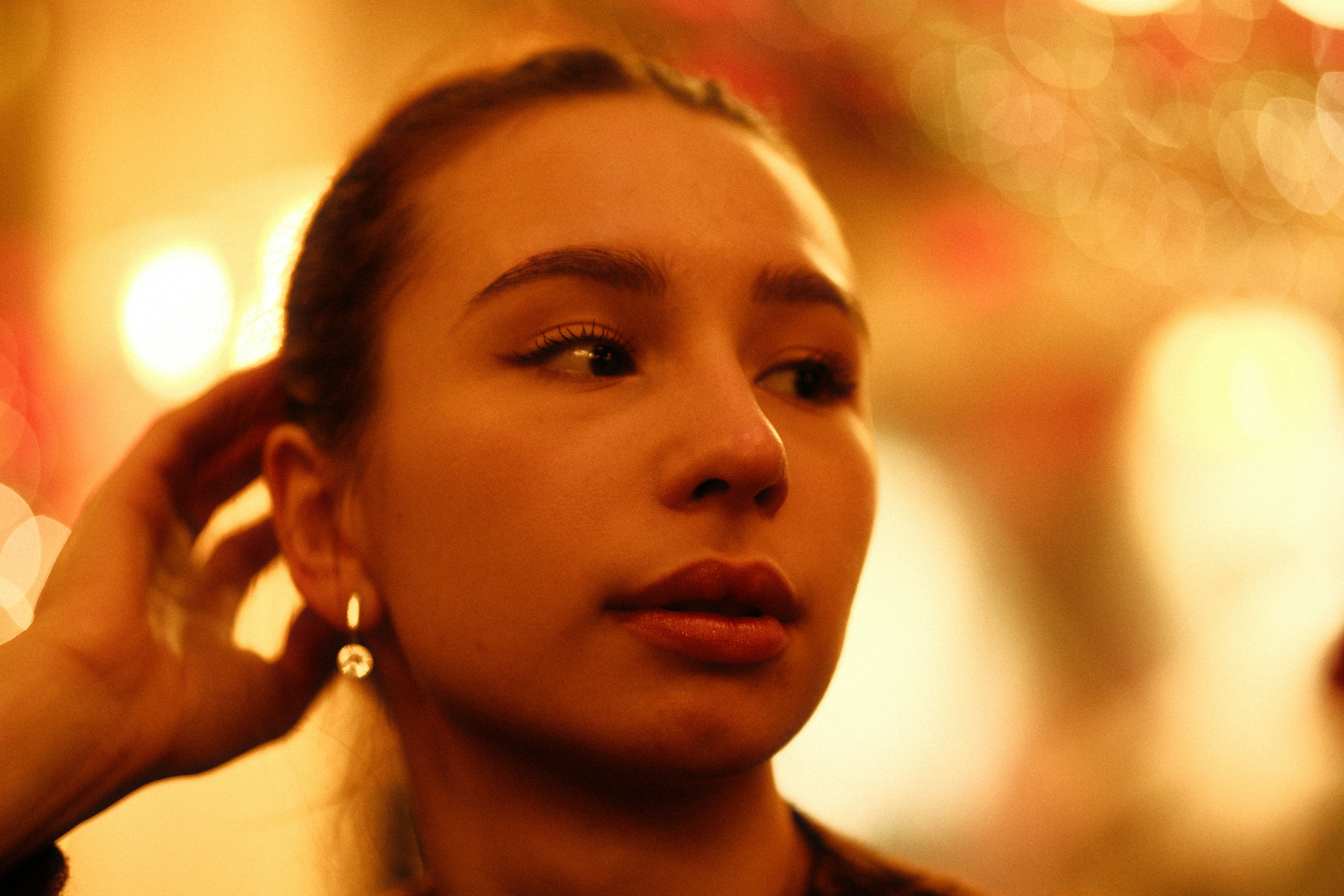 Warm Backlit Portrait: A Moment of Quiet Confidence